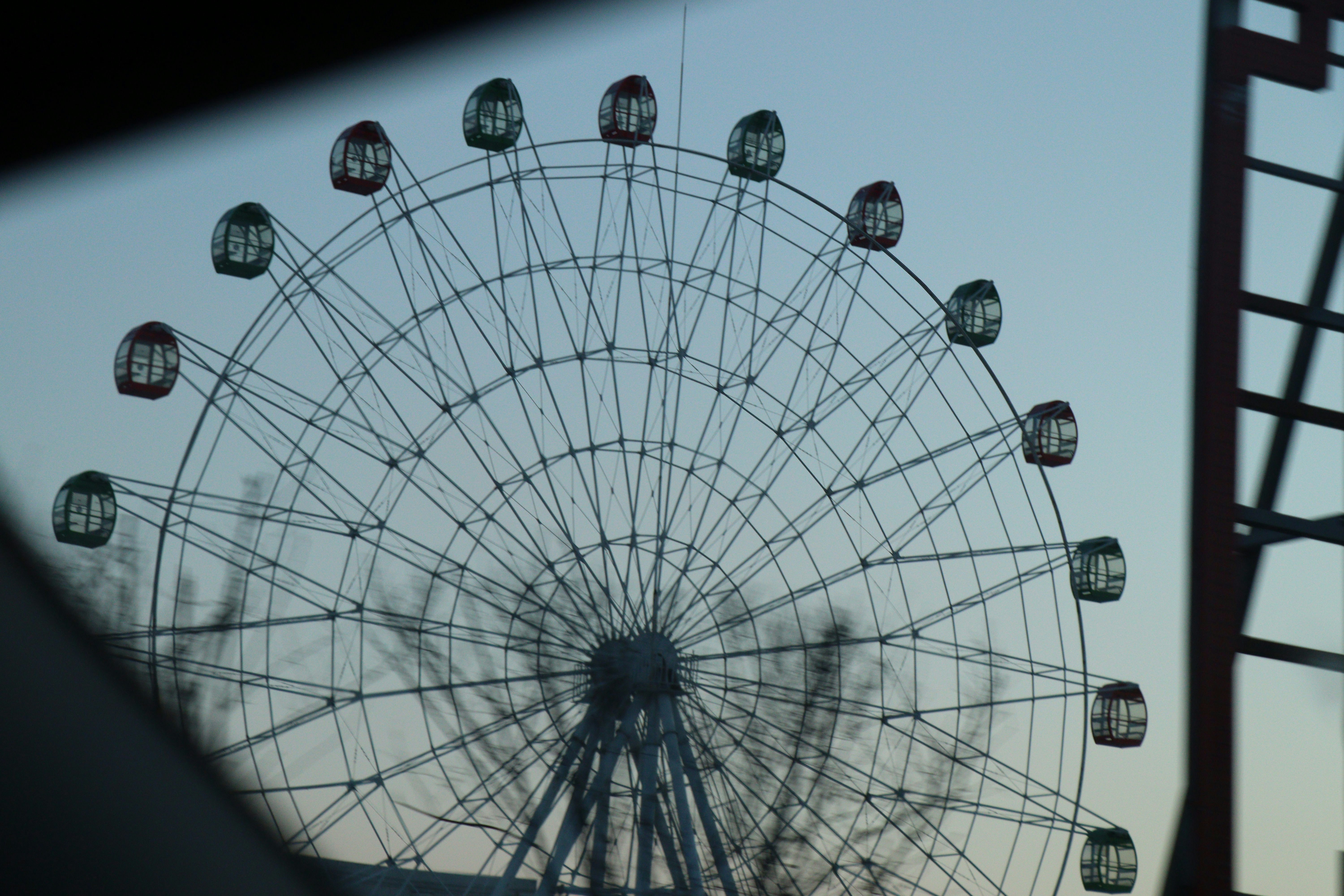 Ferris Wheel Silhouettes: Framing Through a Pier Window