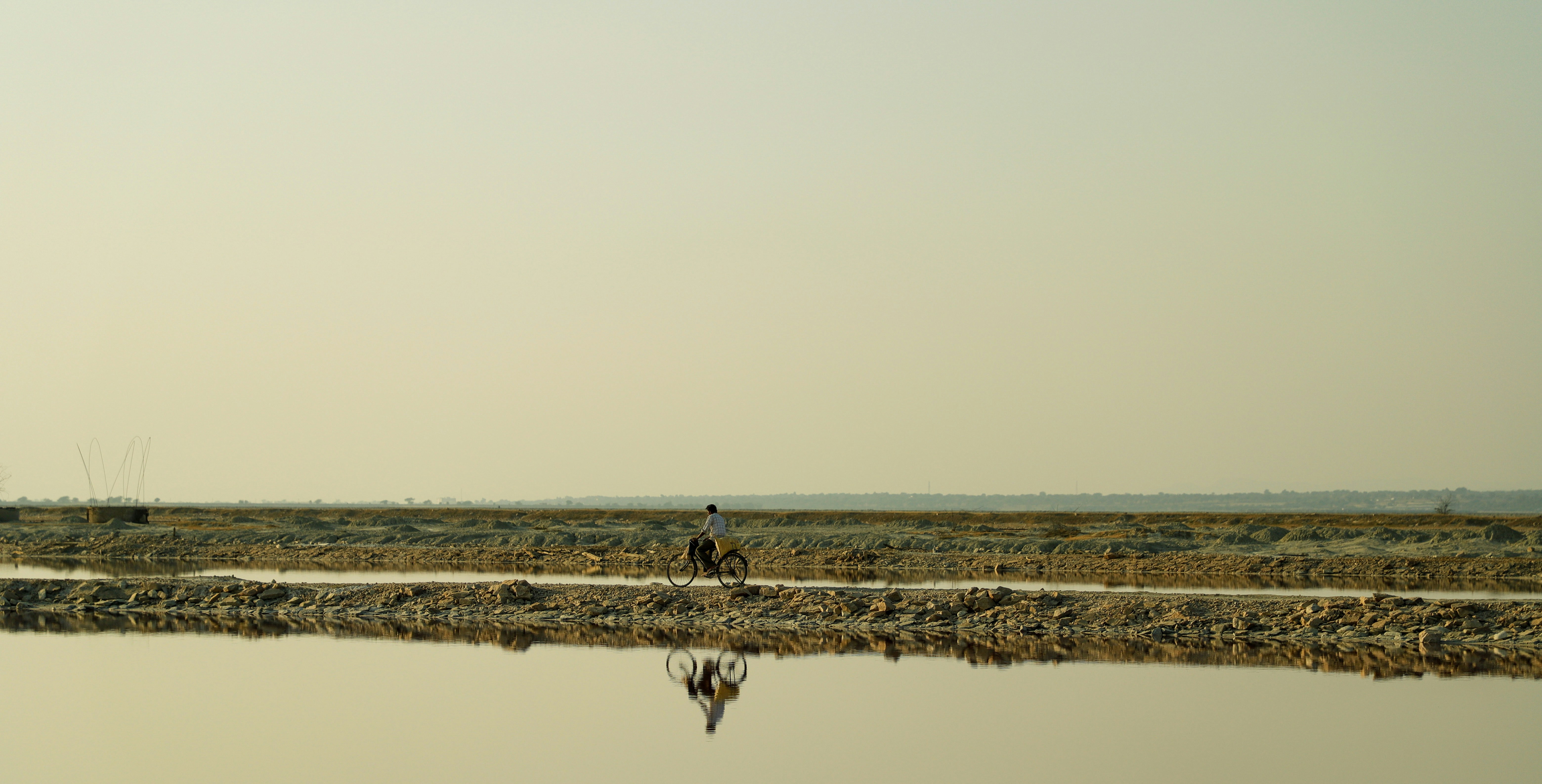 Silent Rider: A Lone Figure at the Waterline