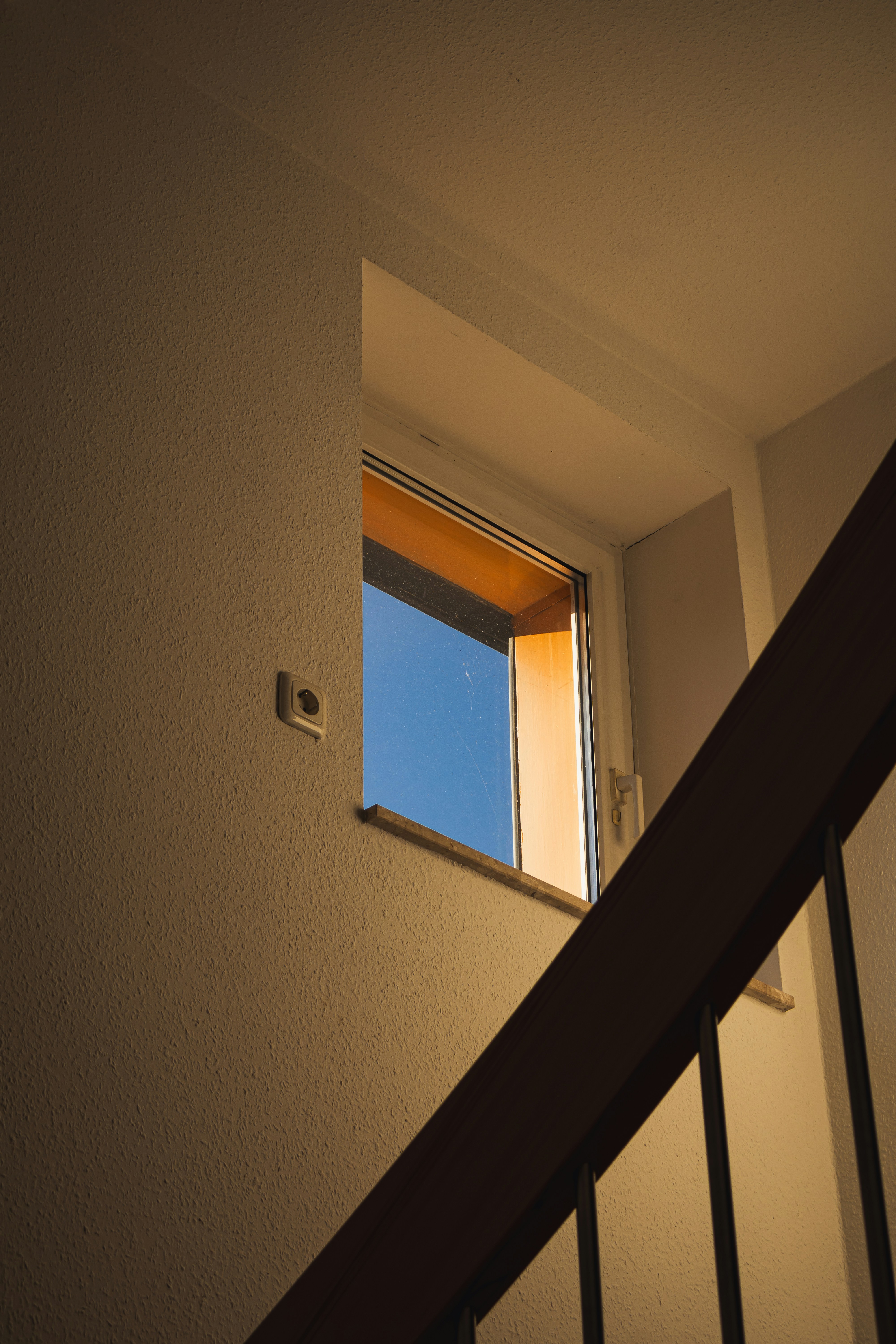 Window Light Framed by Stairs: A Quiet Indoor Moment