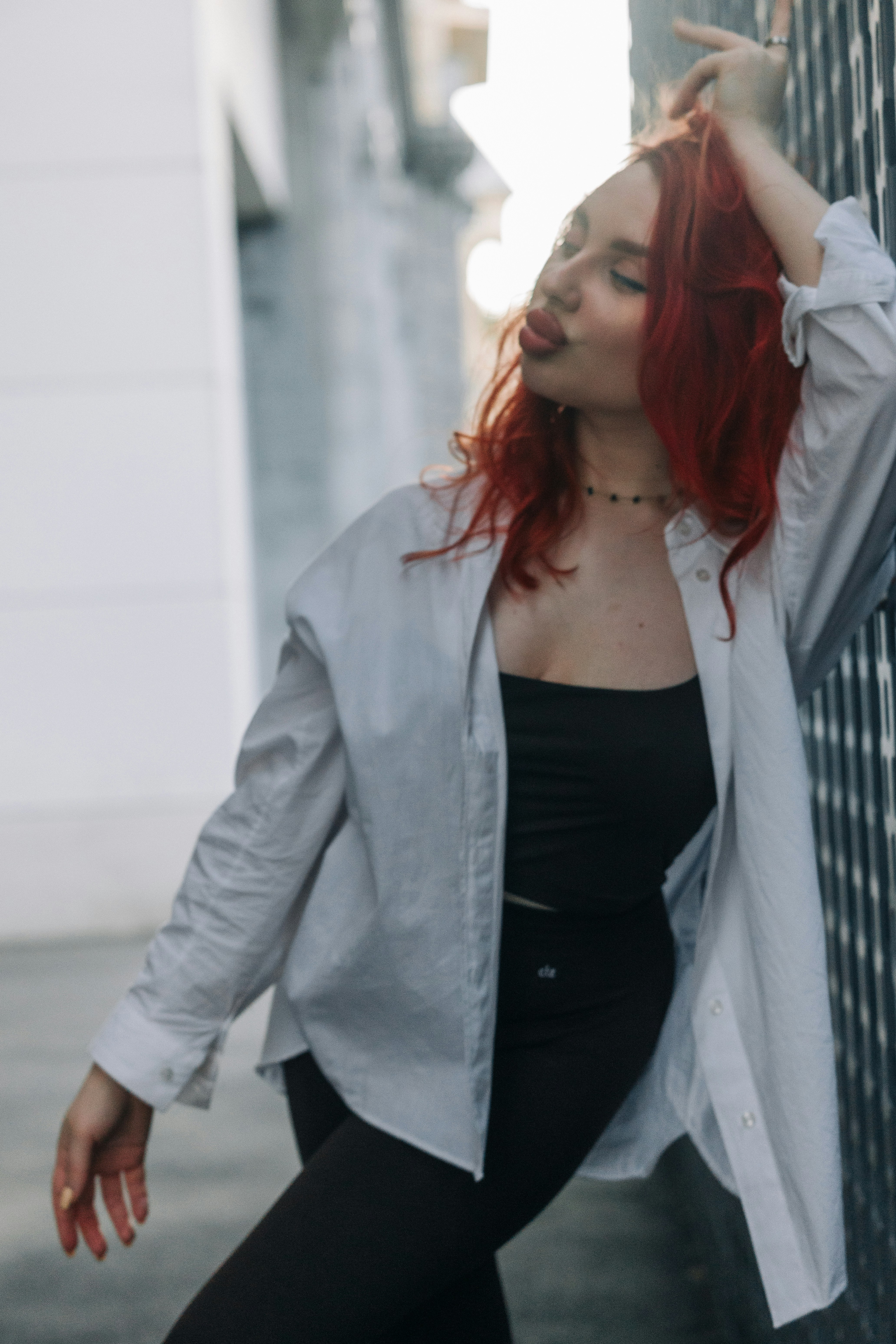 Red-Headed Tilt: A Portrait in Alley Light