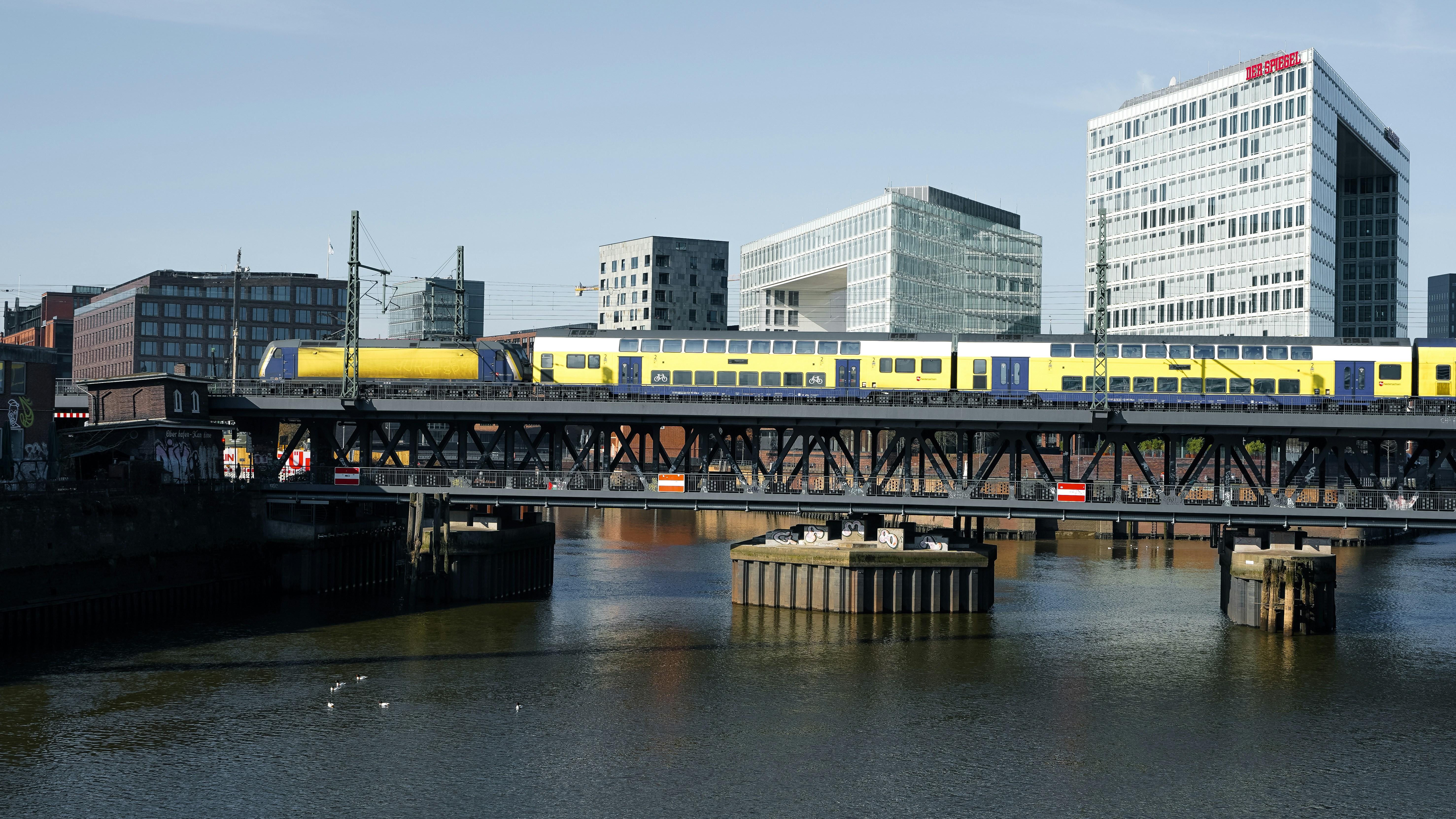 Yellow Train Crossing: Urban Bridge over the River