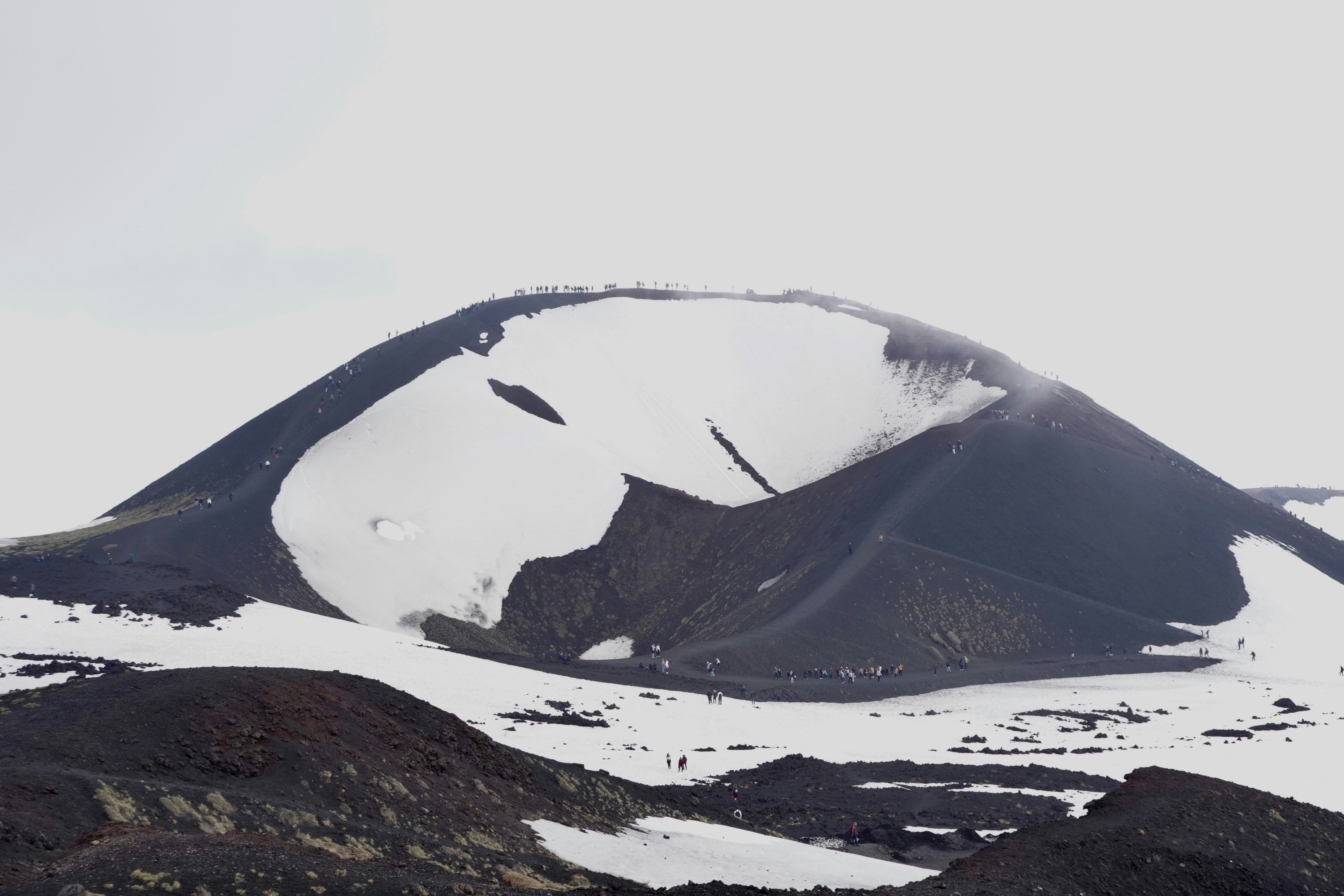 Snowbound Peak: Subtle Light on a Dark, Volcanic Ridge