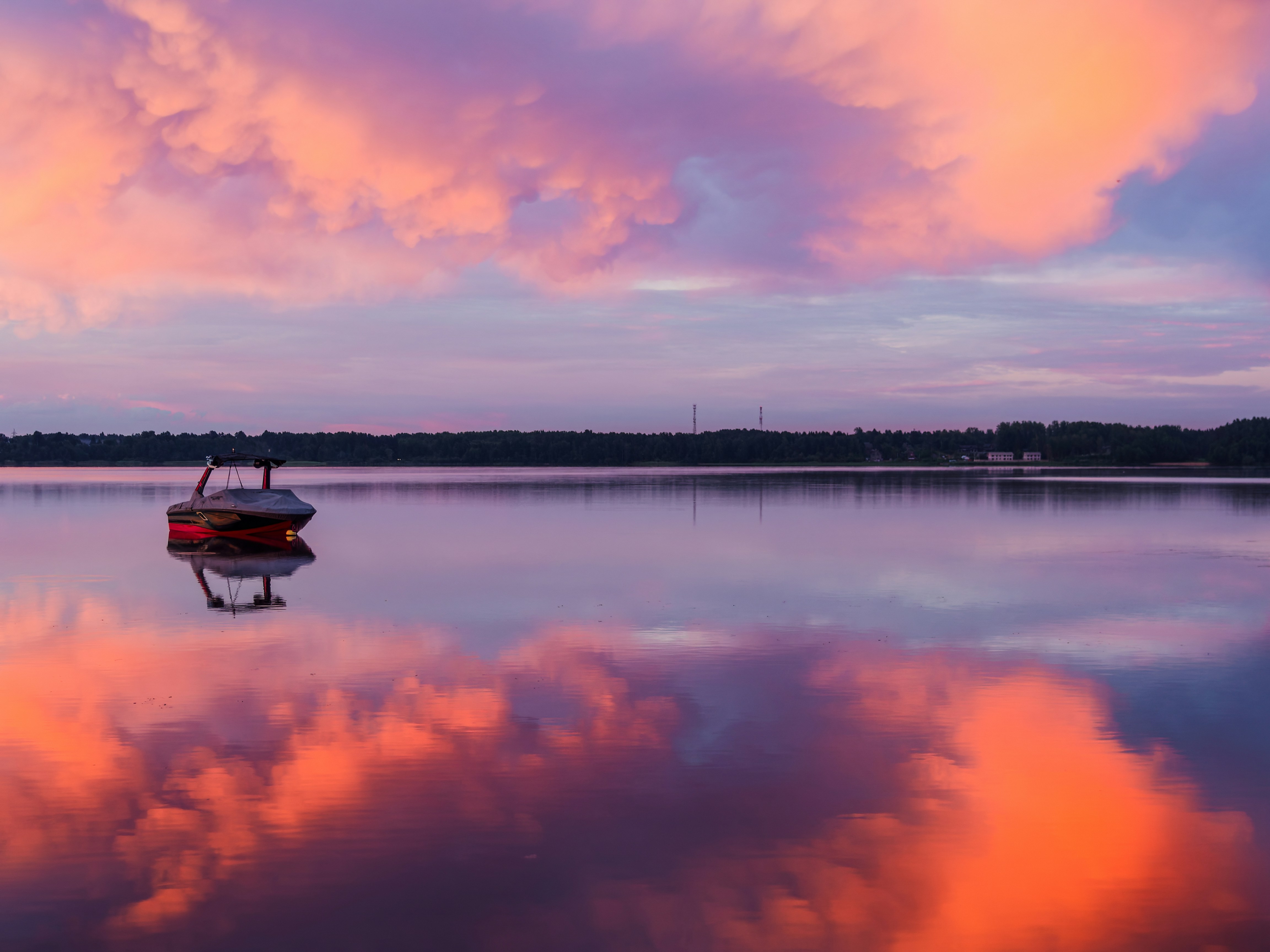 Silent Boat at Sunset: A Mirror-Sky Over a Tranquil Lake