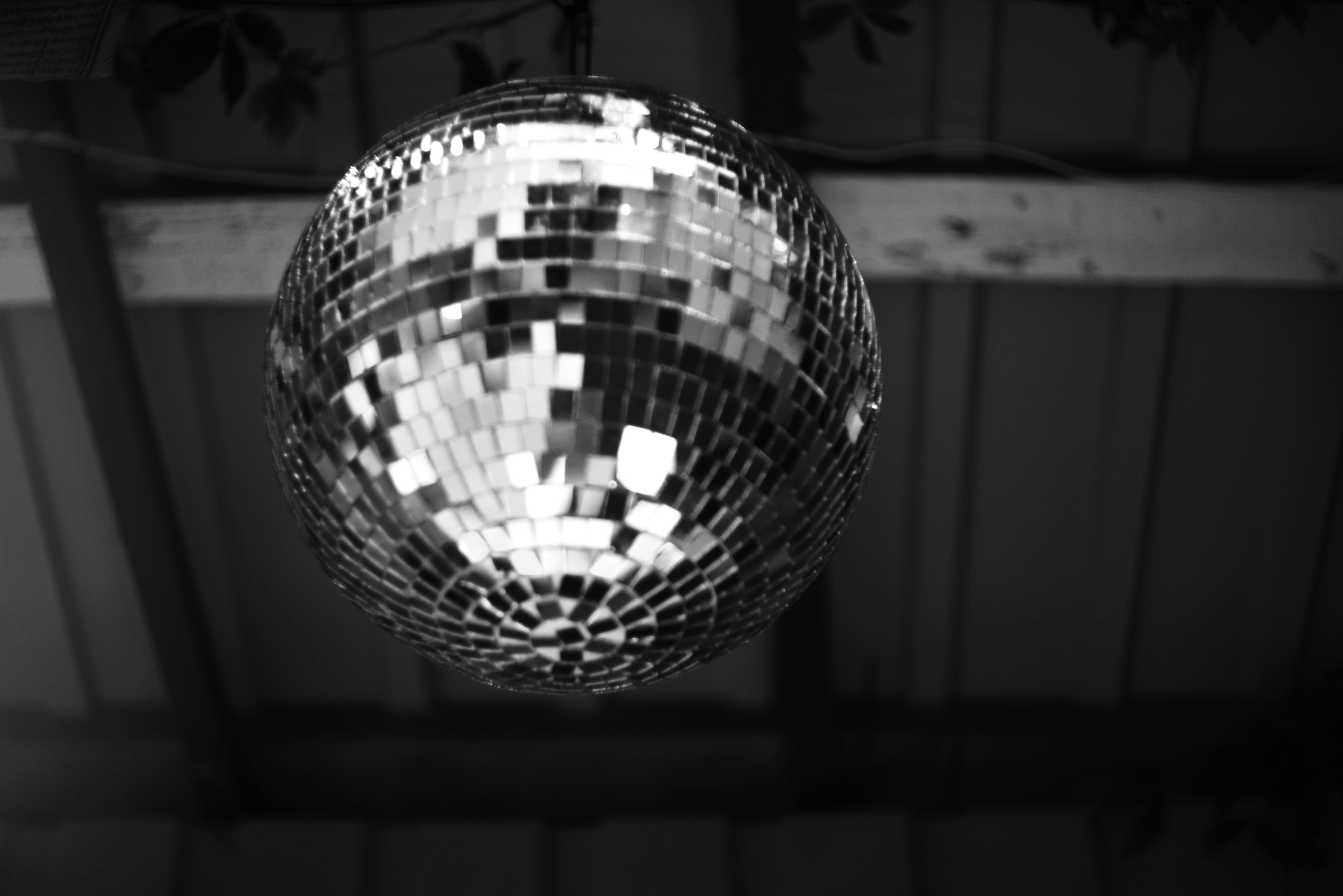 Mirror of Mirrors: A Floating Disco Sphere in Dim Loft Light