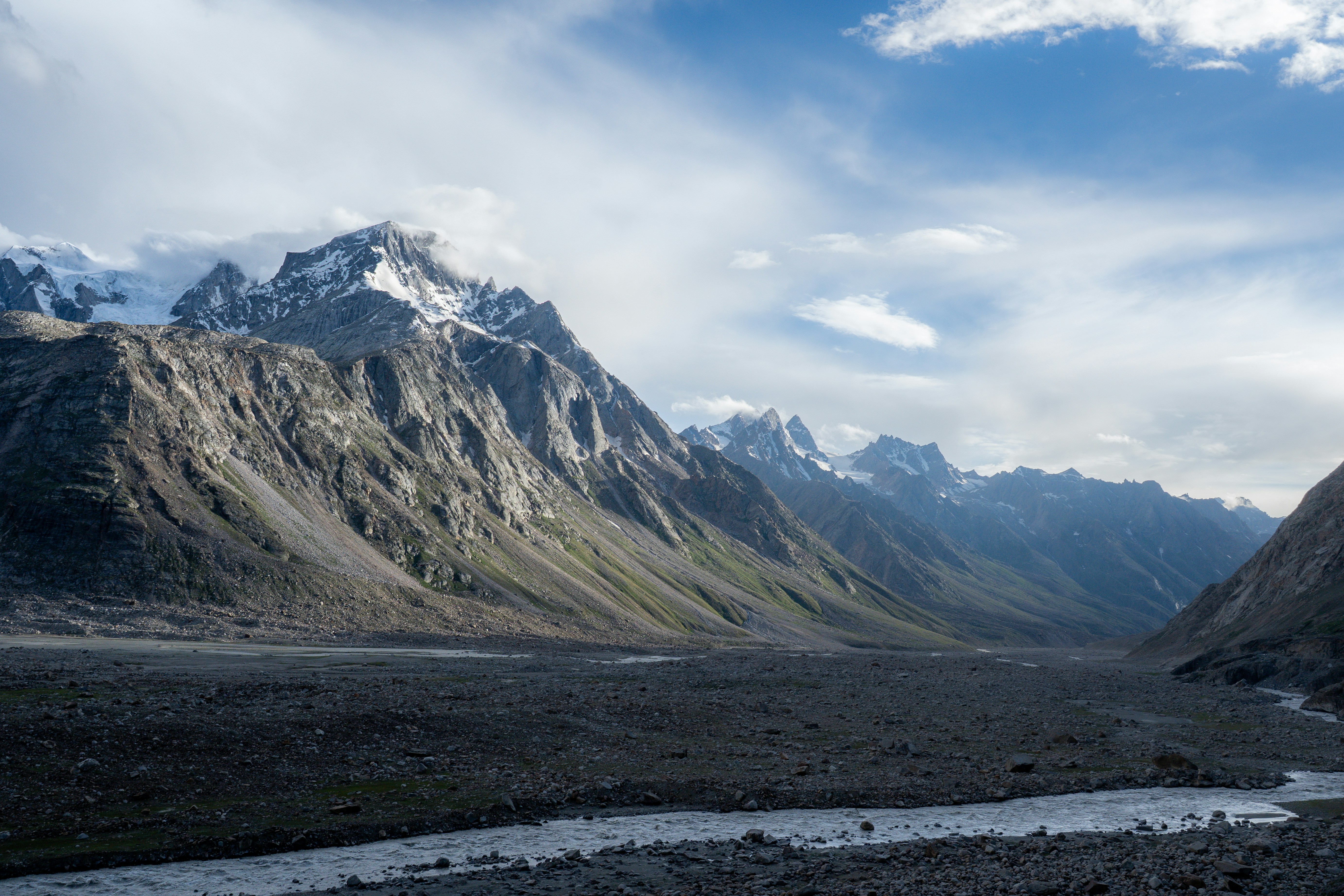 Glacial valley under a sculpted ridge