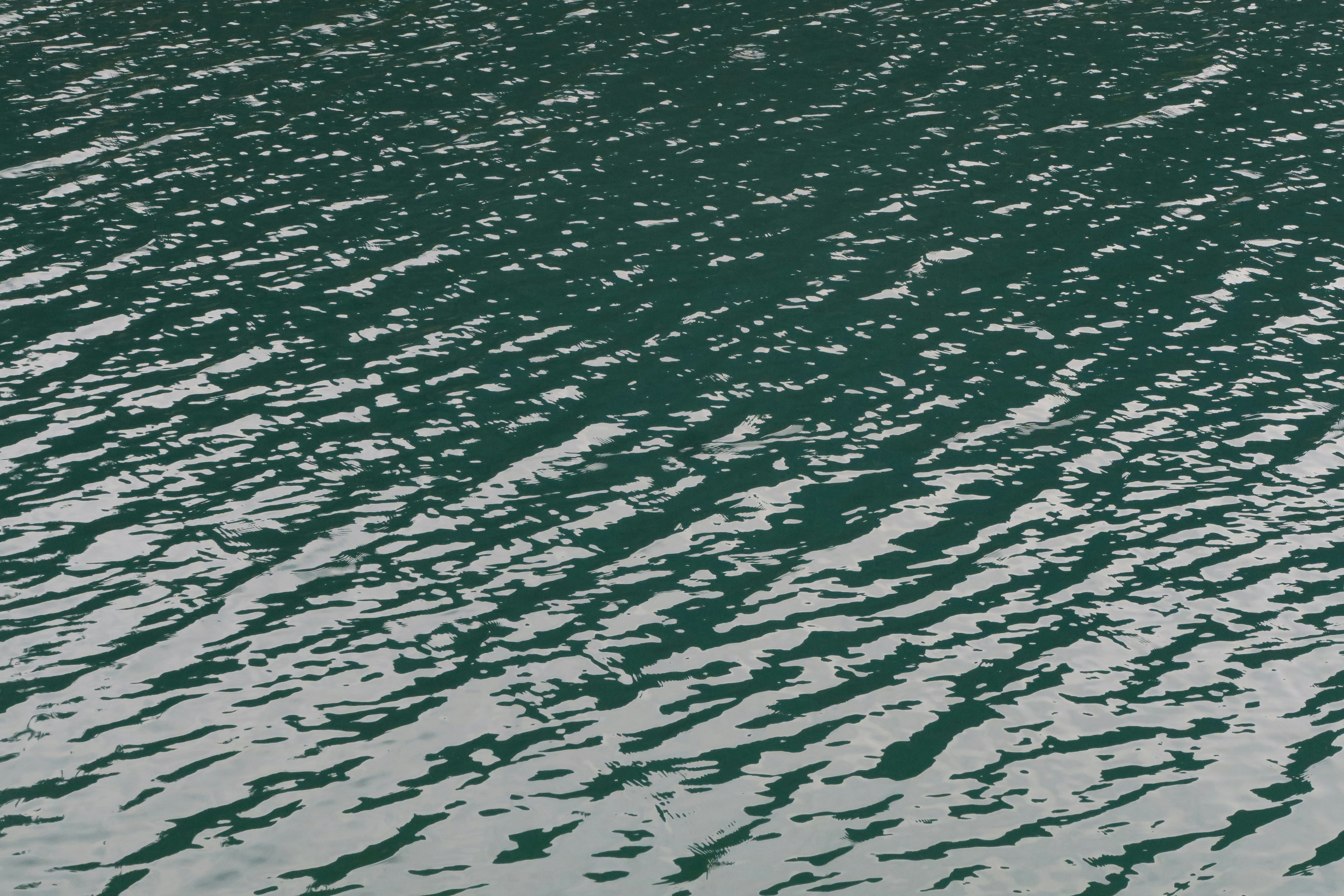 Patterns in the Deep: Teal Ripples Across Quiet Seas