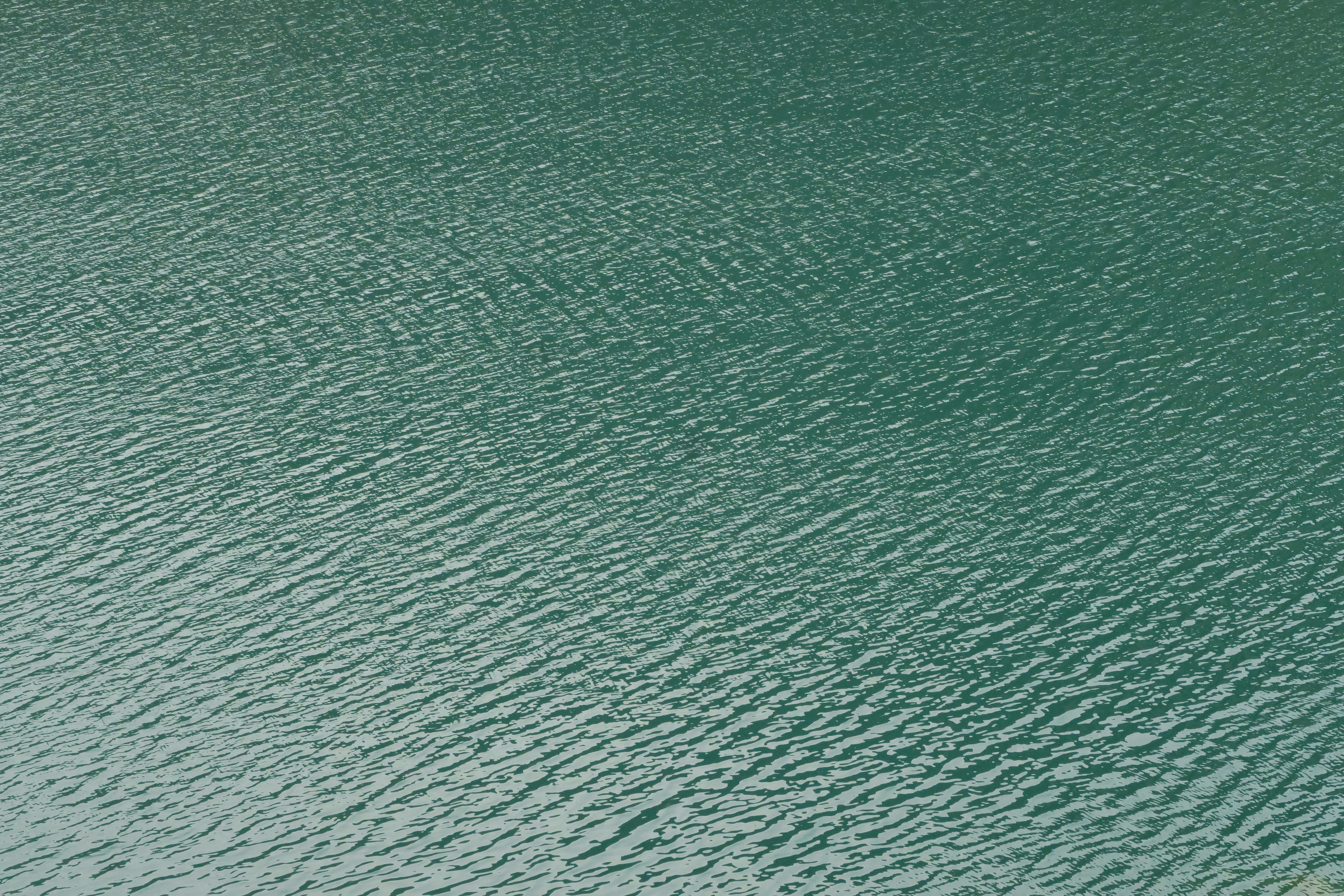 Silent Ripples: A Close-Cropped Teal Stretch of Water