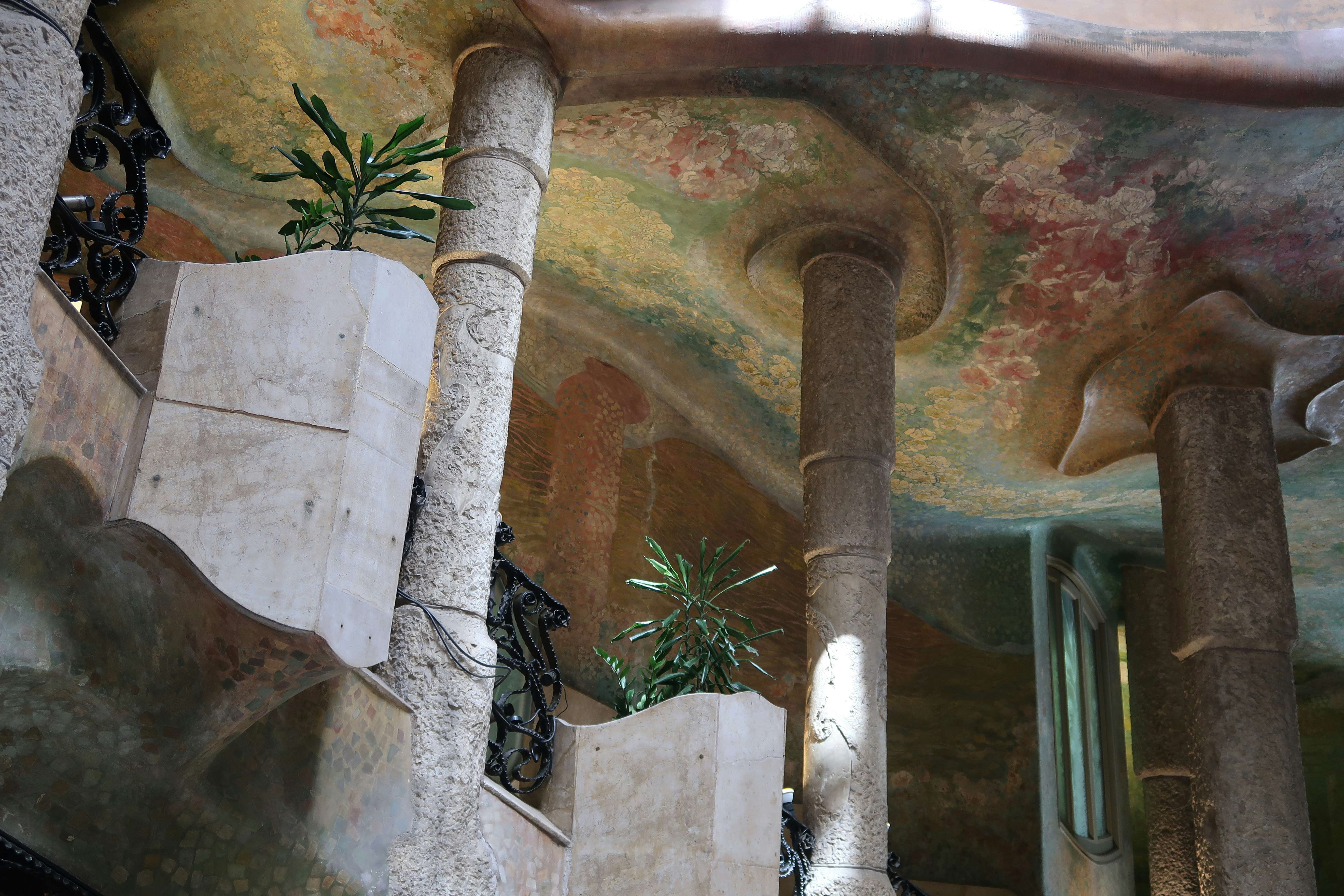 Stone Columns and Painted Vaults in a Sunlit Interior Terrace