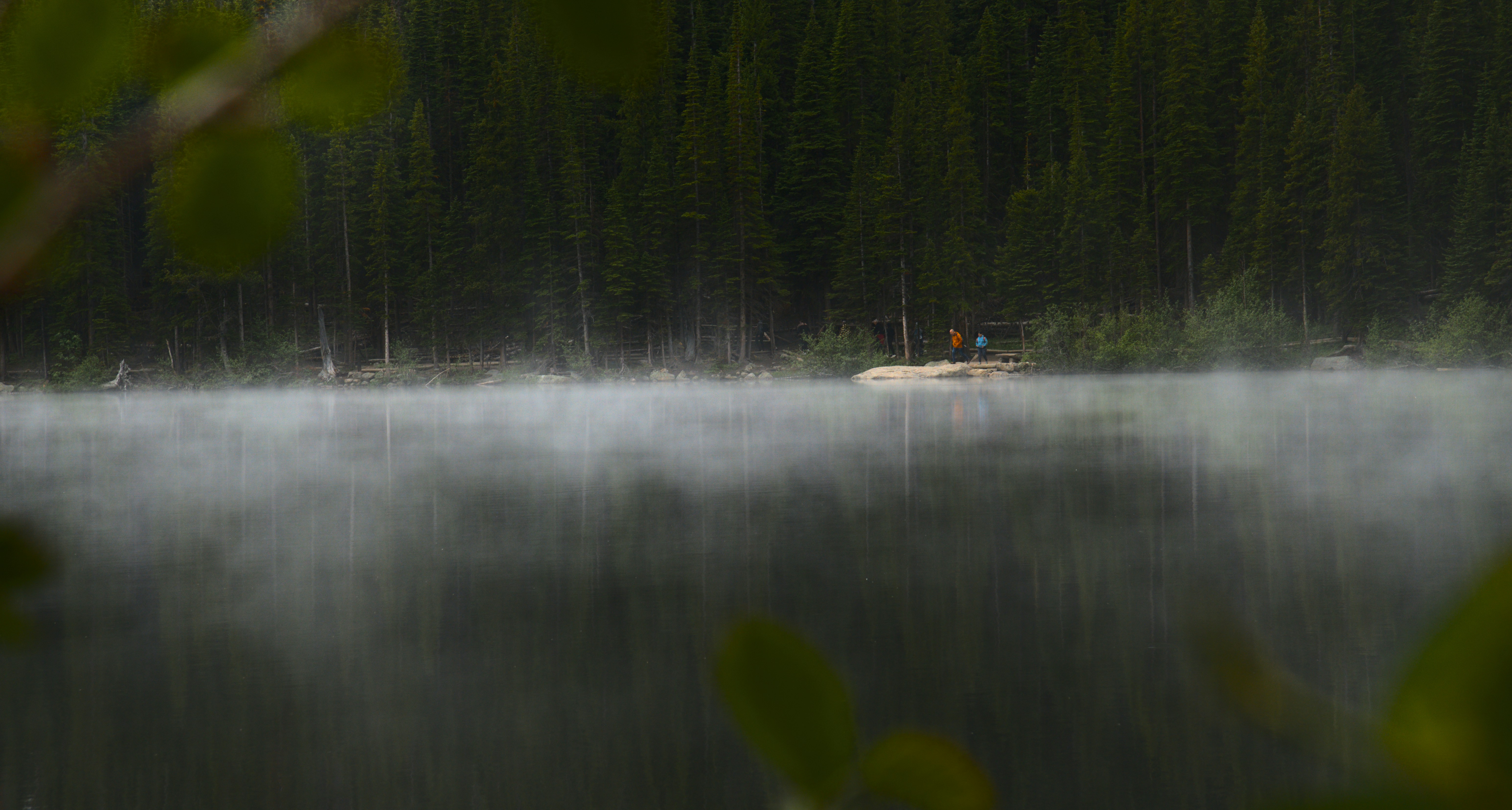 Mist-veiled Boat Above Quiet Lake