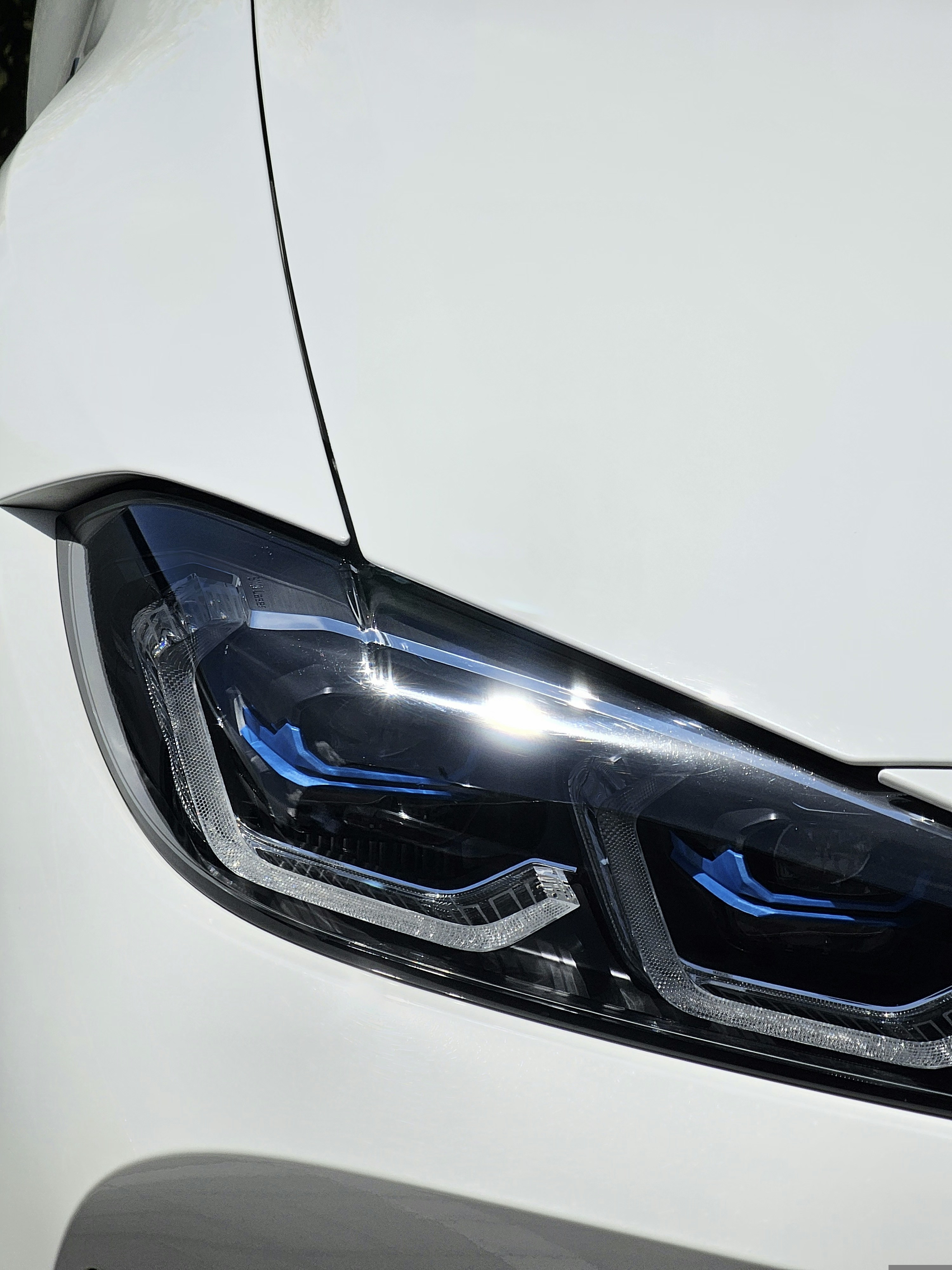 Close-Up of a Modern Headlight: Precision Lines and Shadowed Curves