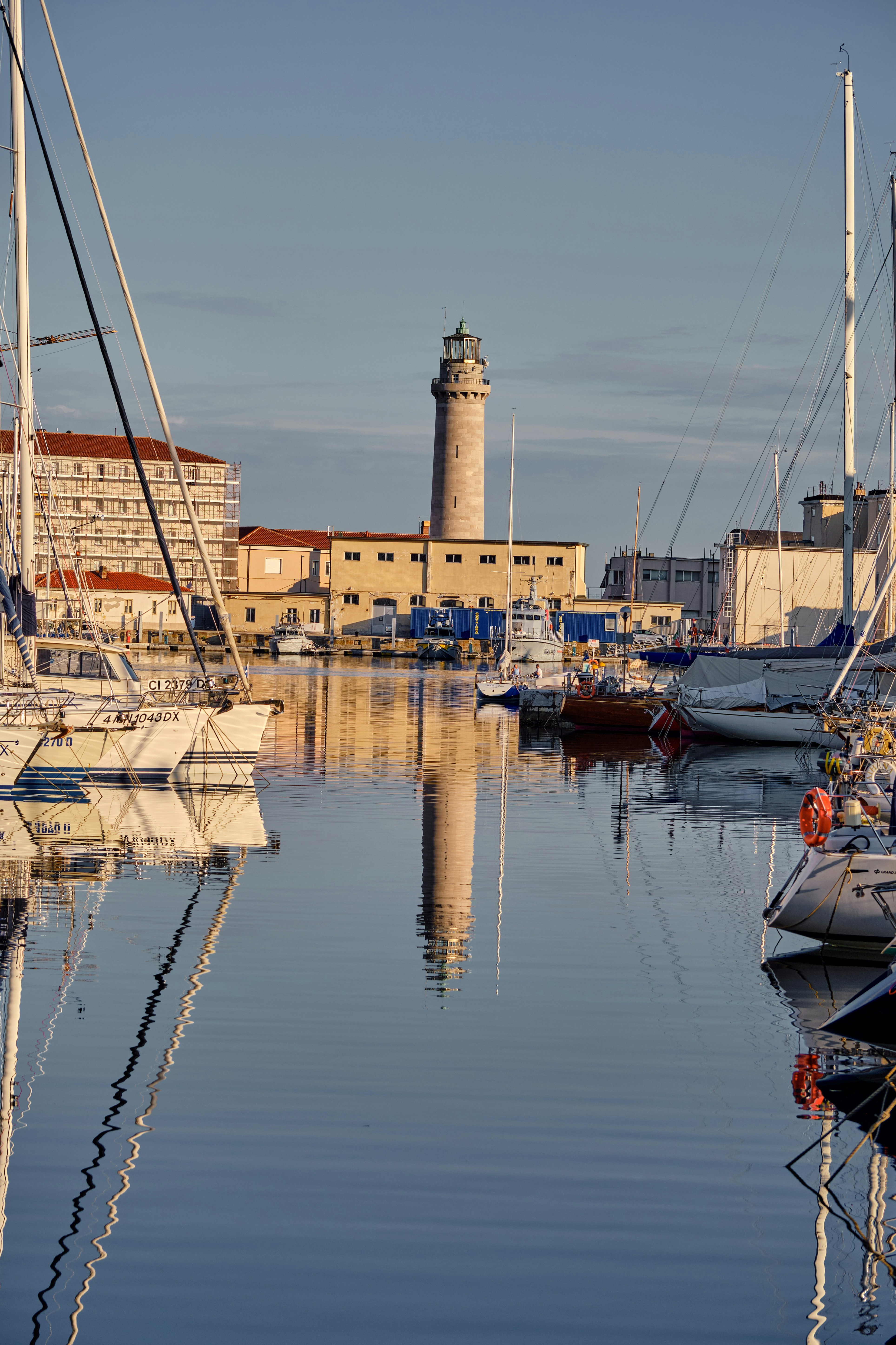 Lighthouse Gatekeeper: reflections at the harbor