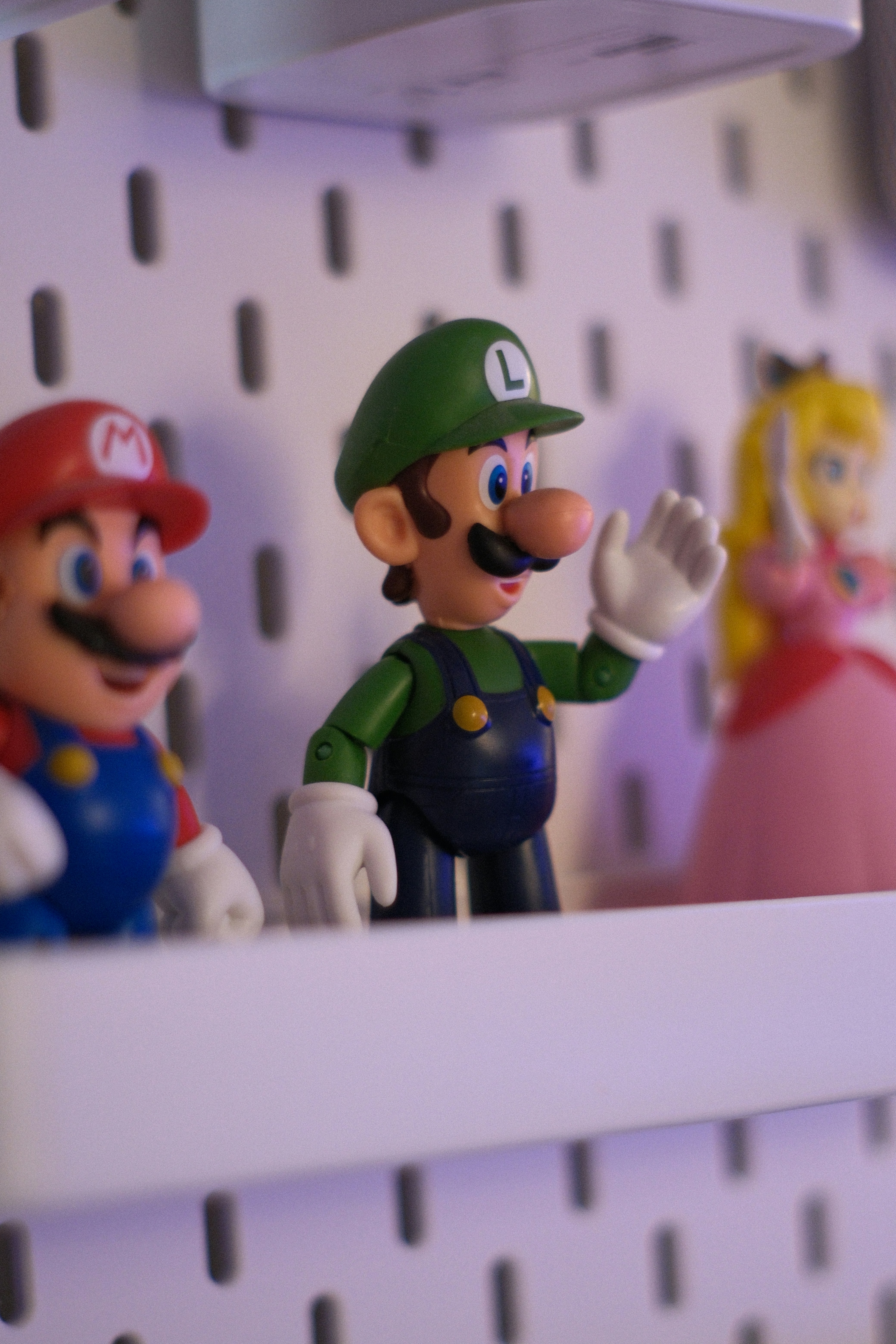 Green-Capped Mario Waves to the Shelf of Toy Figures