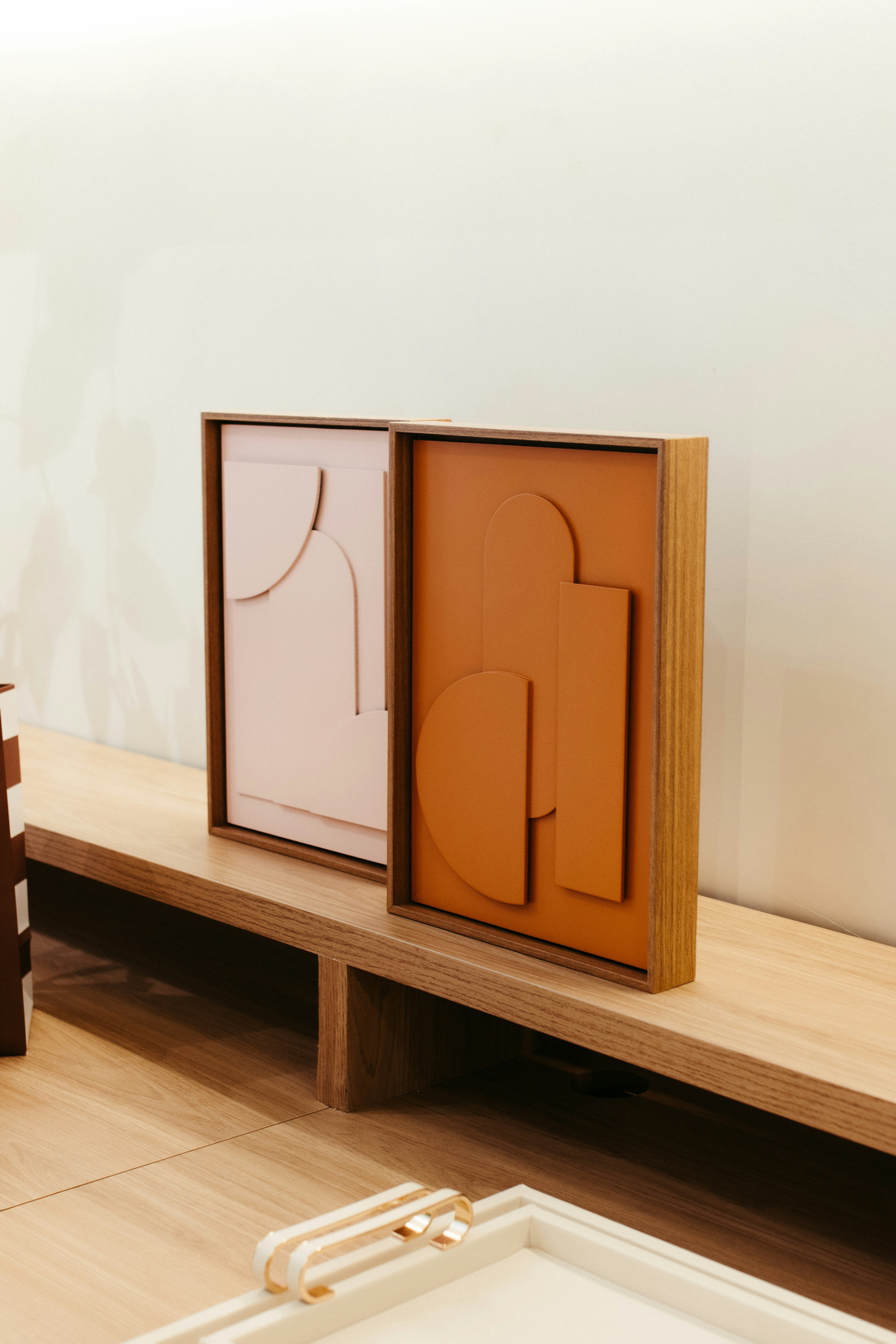 Geometric Art Works on a Wooden Shelf