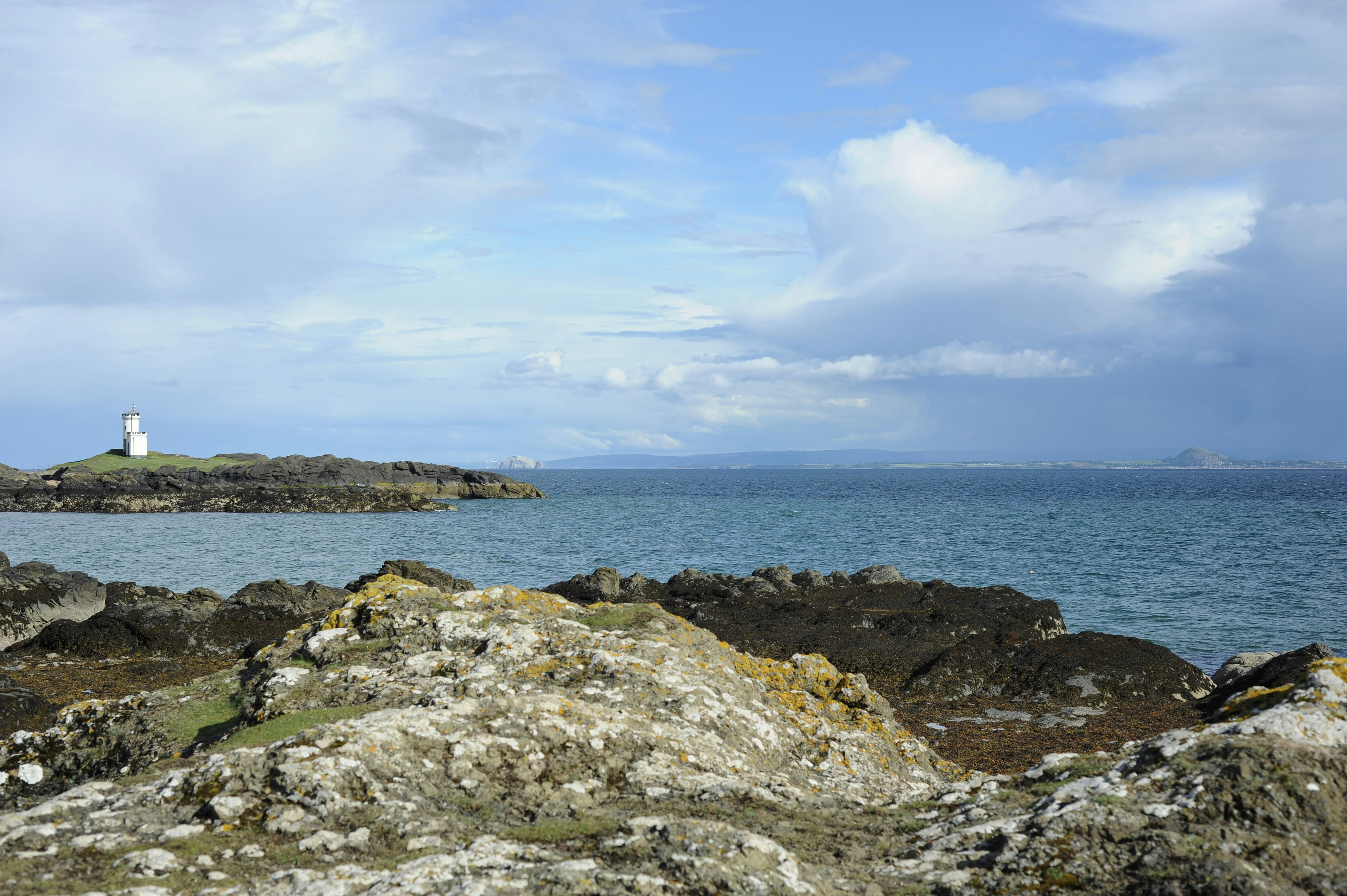 Ledge Edge at Distant Lighthouse