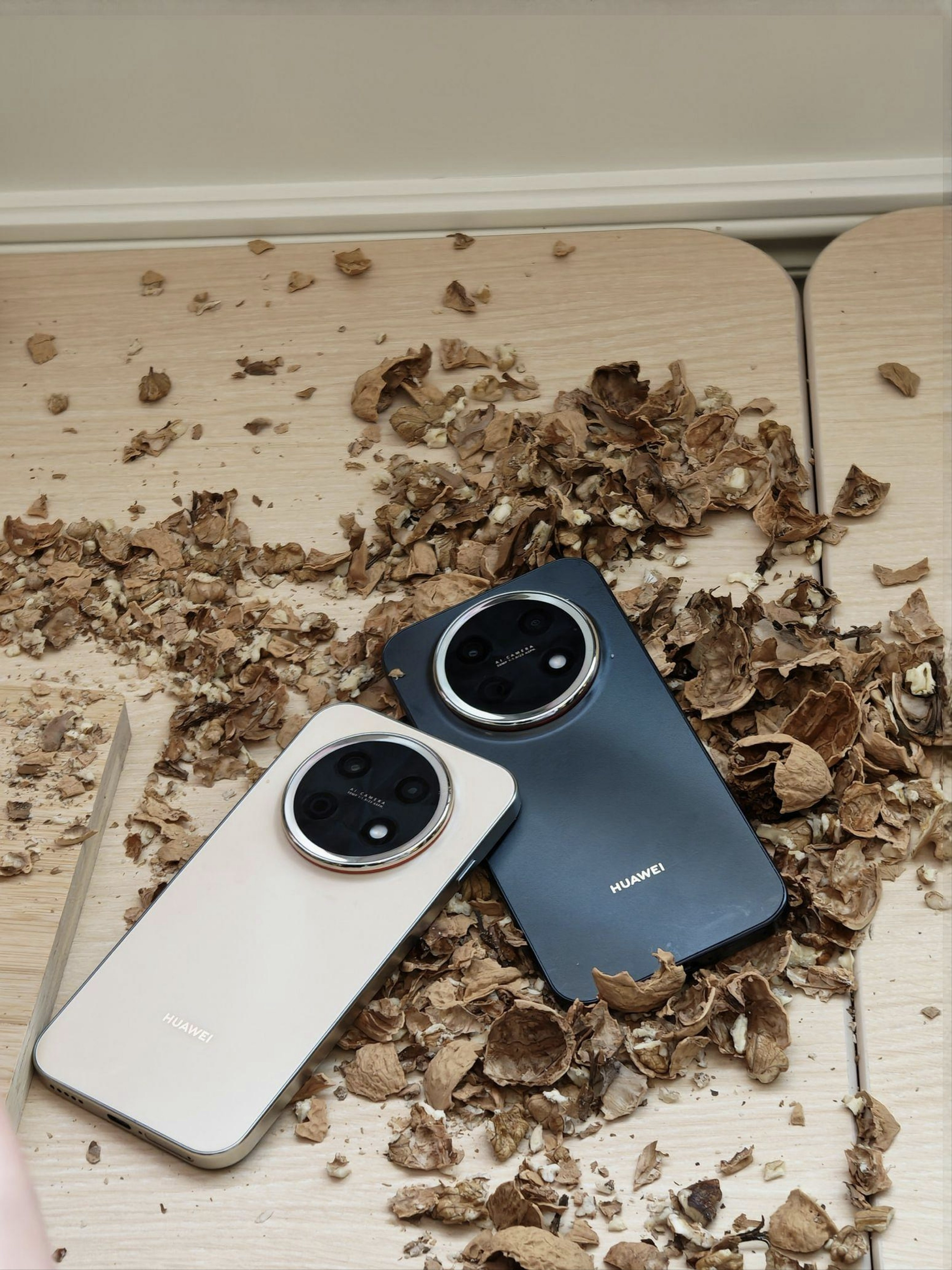 Two Huawei Gimbal Phones Rest Among Wood Shavings