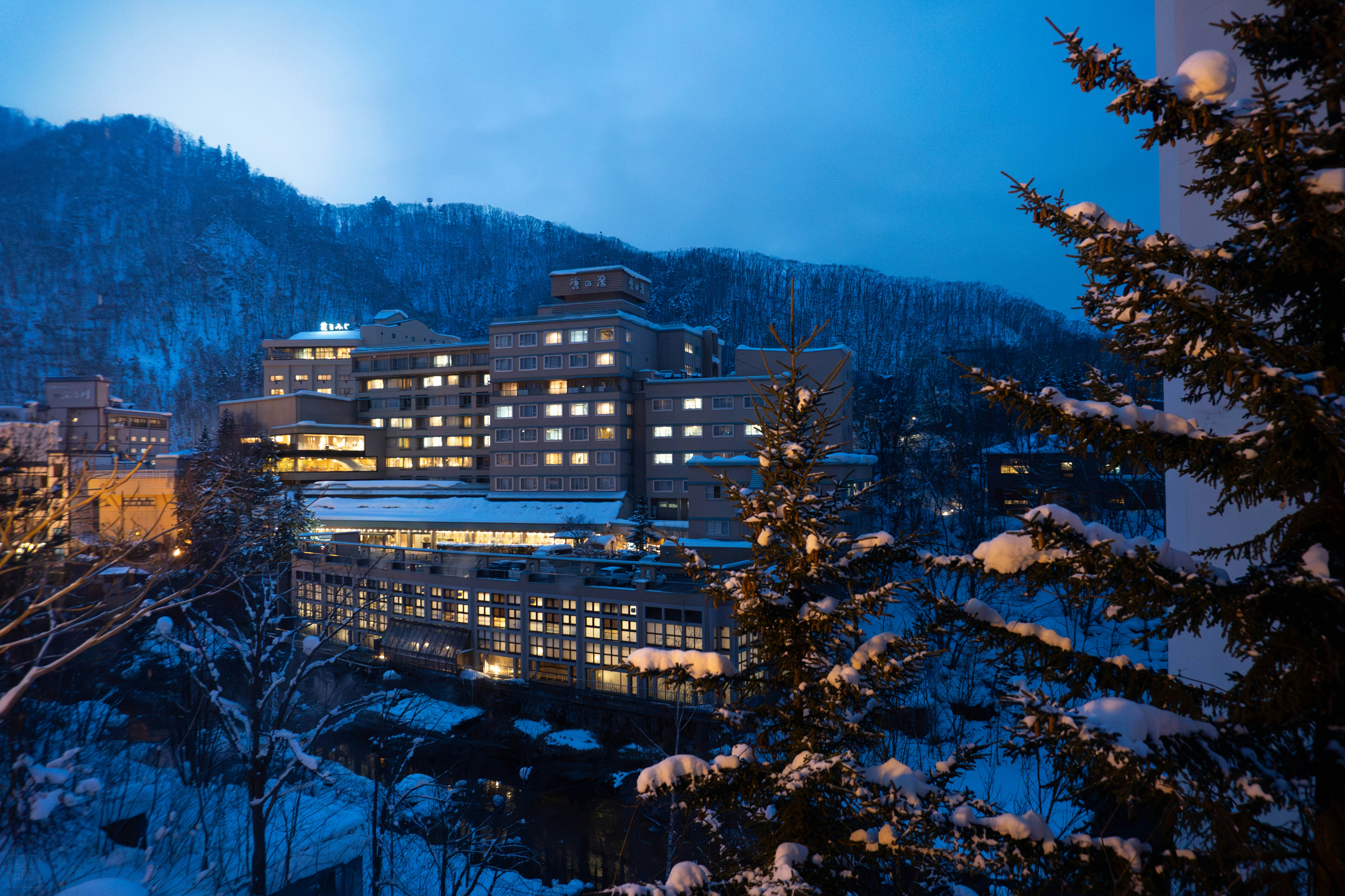 Snowbound Lodge Beneath a Blue Evening Sky