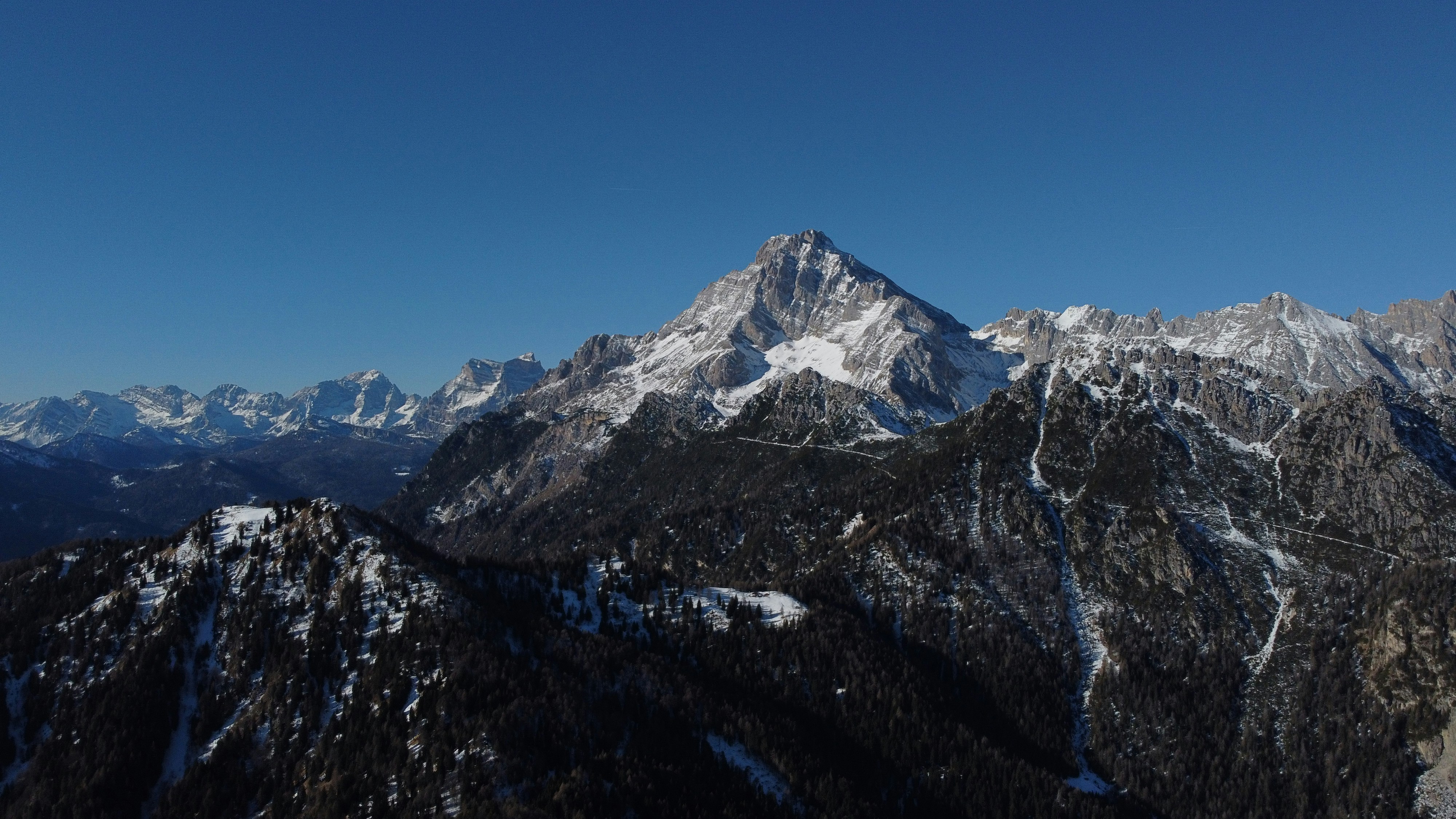 Snow-Crowned Peak Against a Clear Alpine Sky