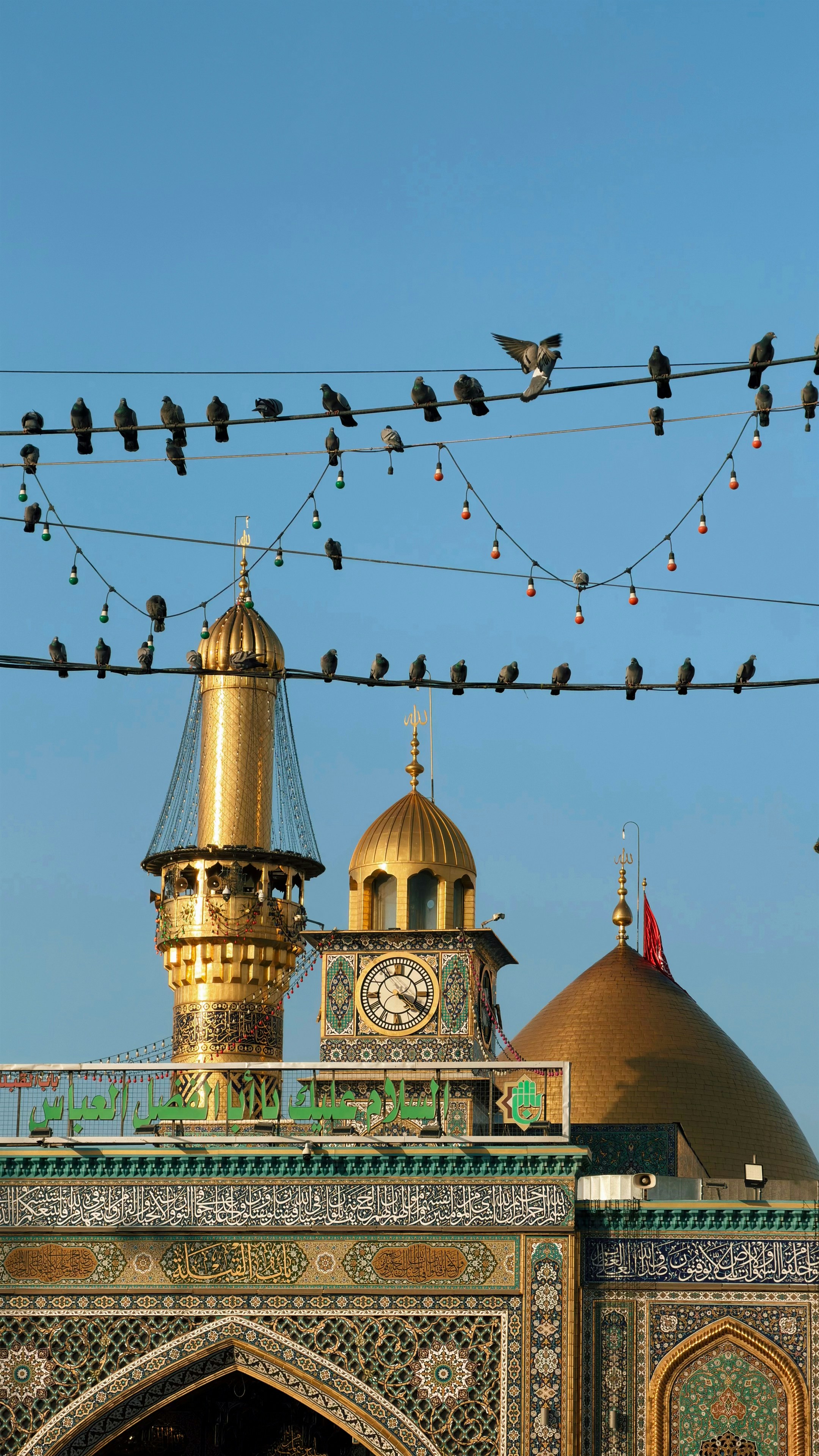 Golden Minarets Under a String of Night Lights
