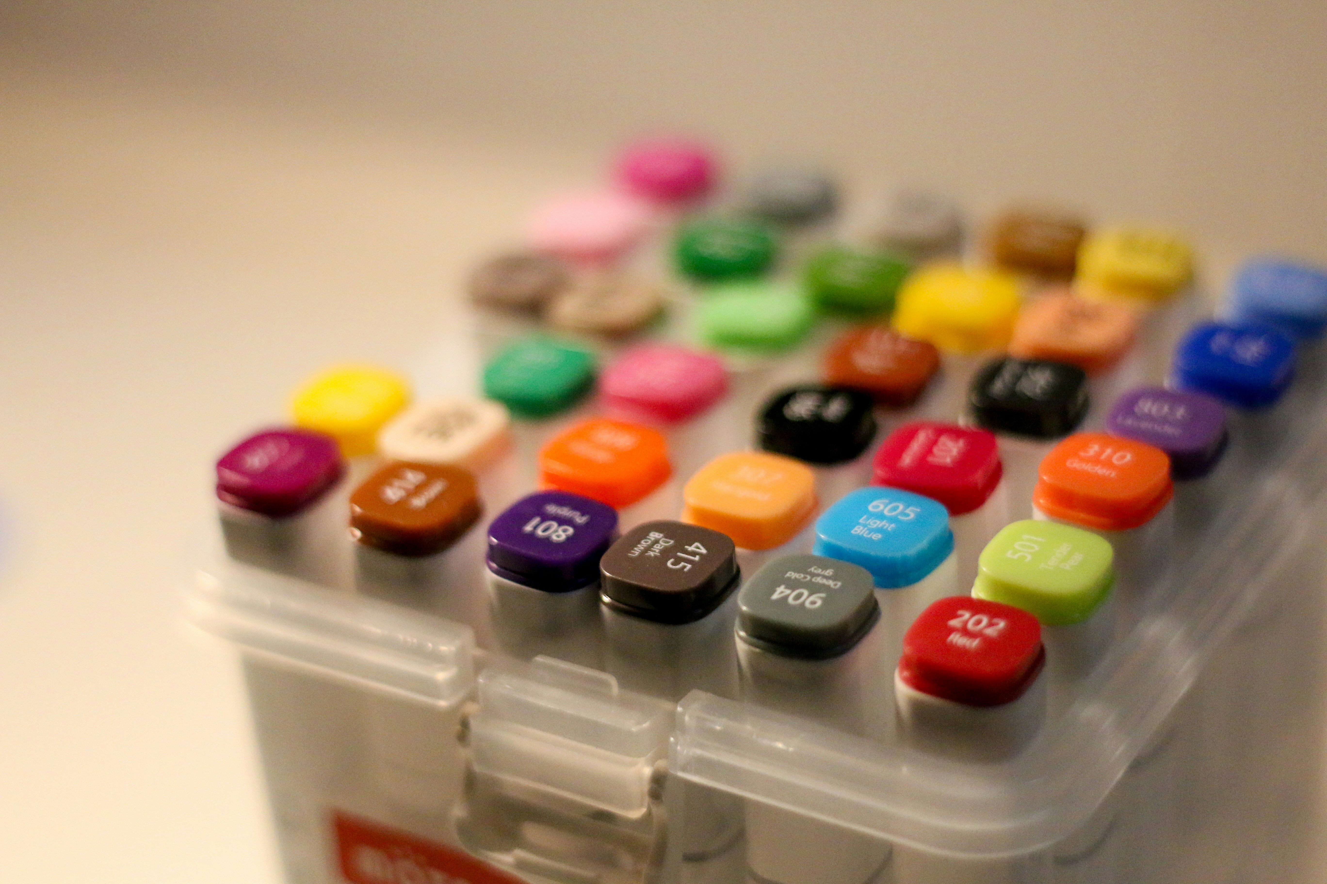 Capsule of Color: A Close-Up Stack of Marker Caps