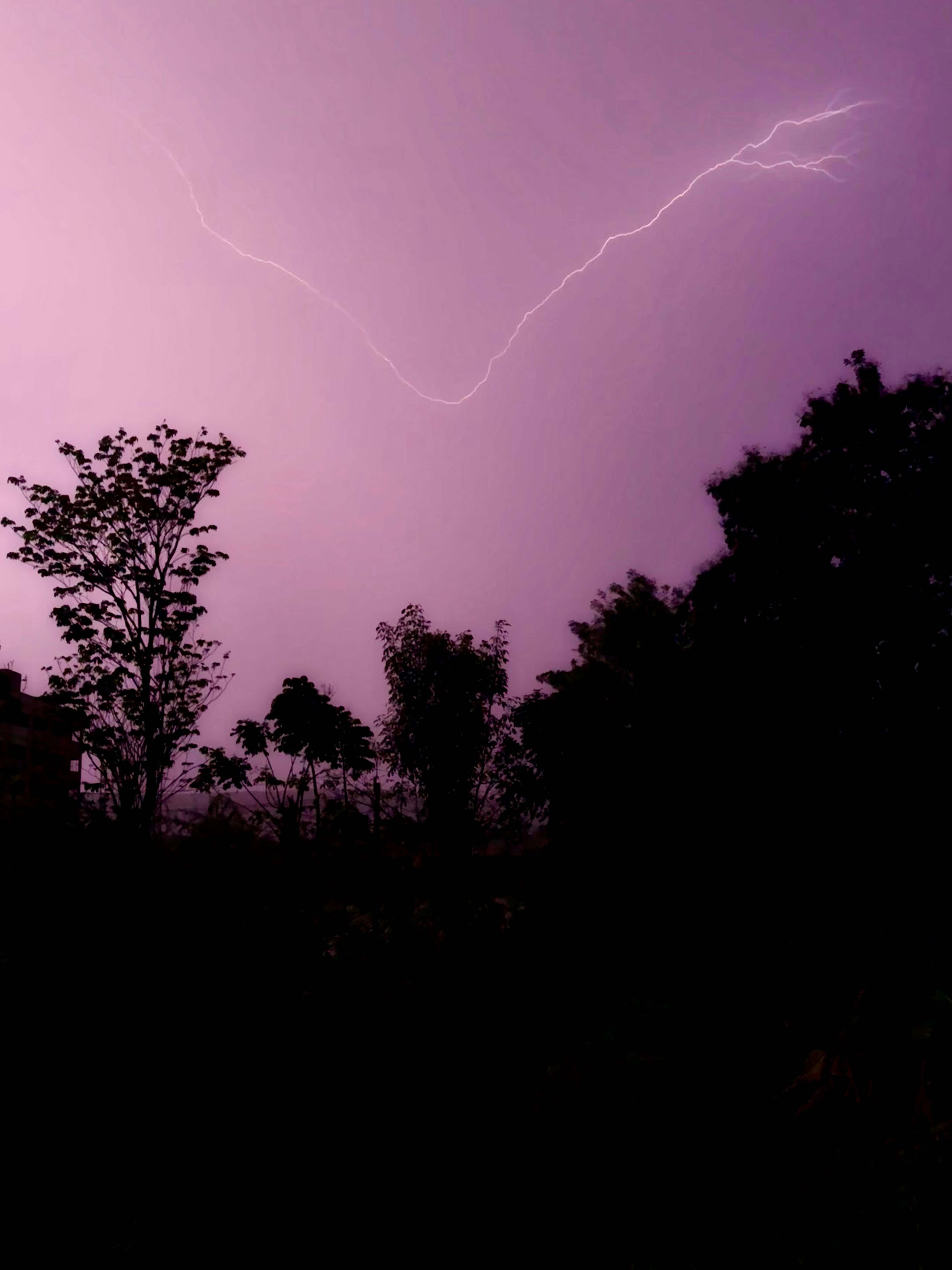 Lightning Arc Across a Purple Twilight Sky