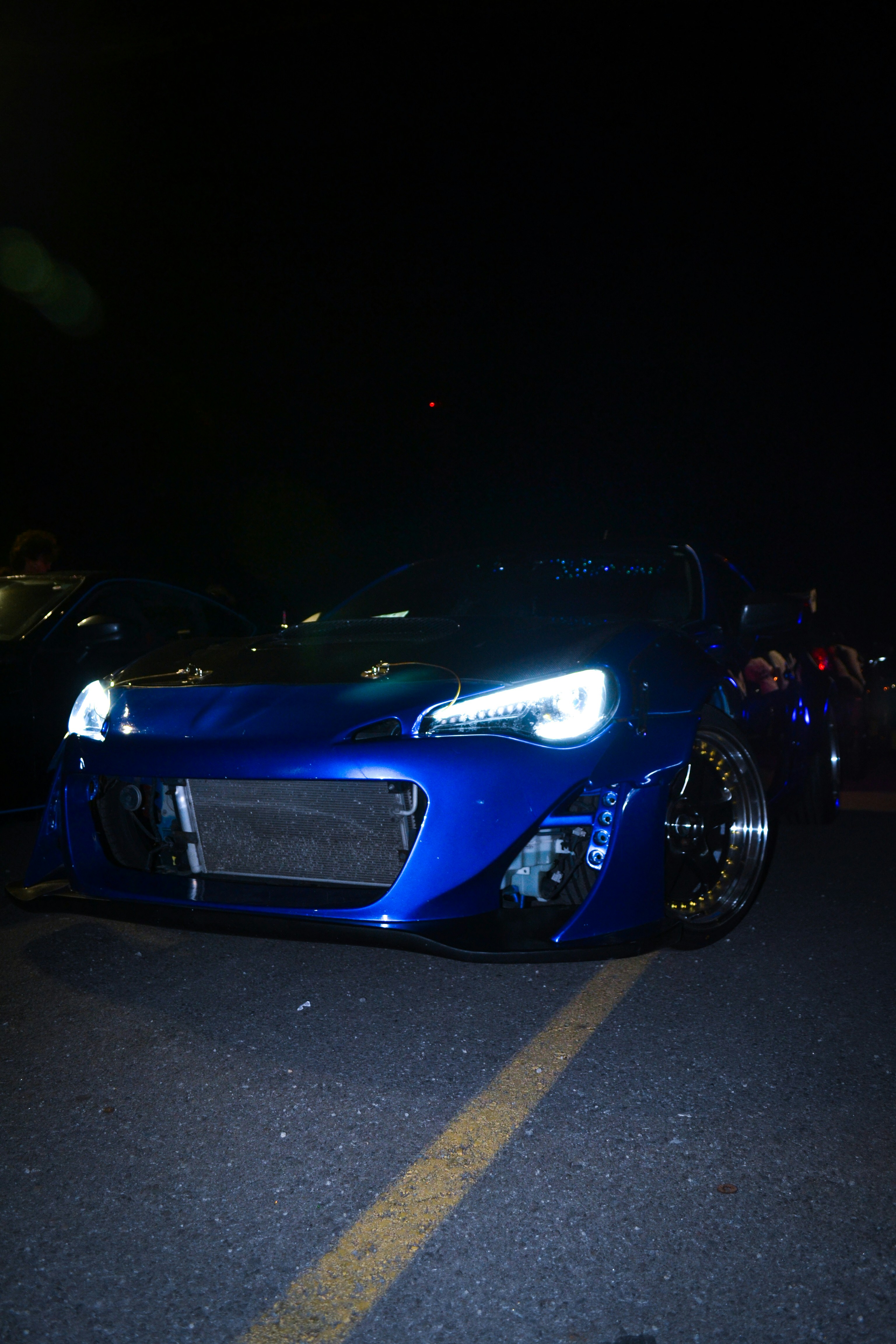 Midnight Blue Street Racer: Neon Highlights and Low-Light Power