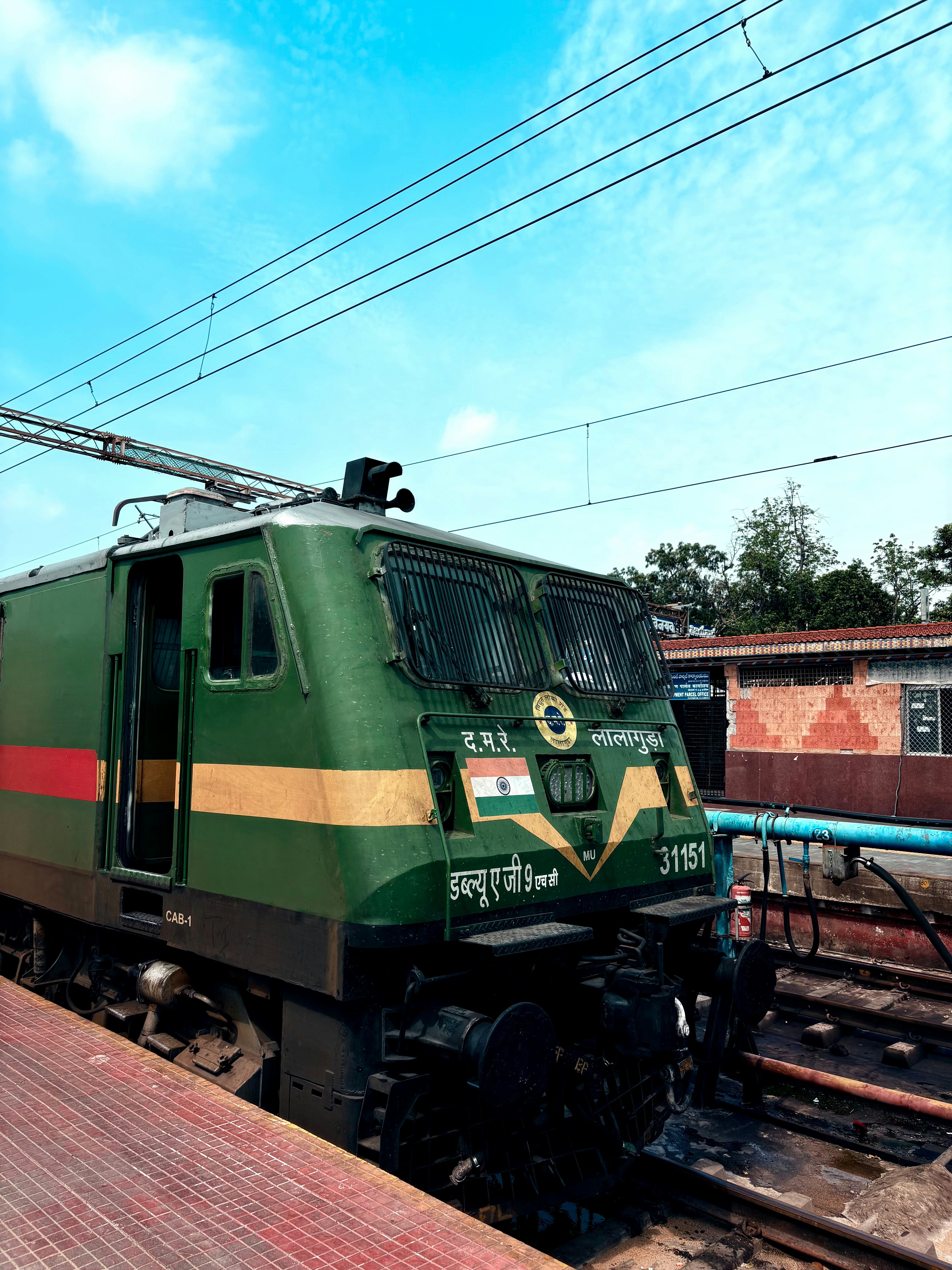 Green Locomotive at Platform Edge in Indian Rail Yard