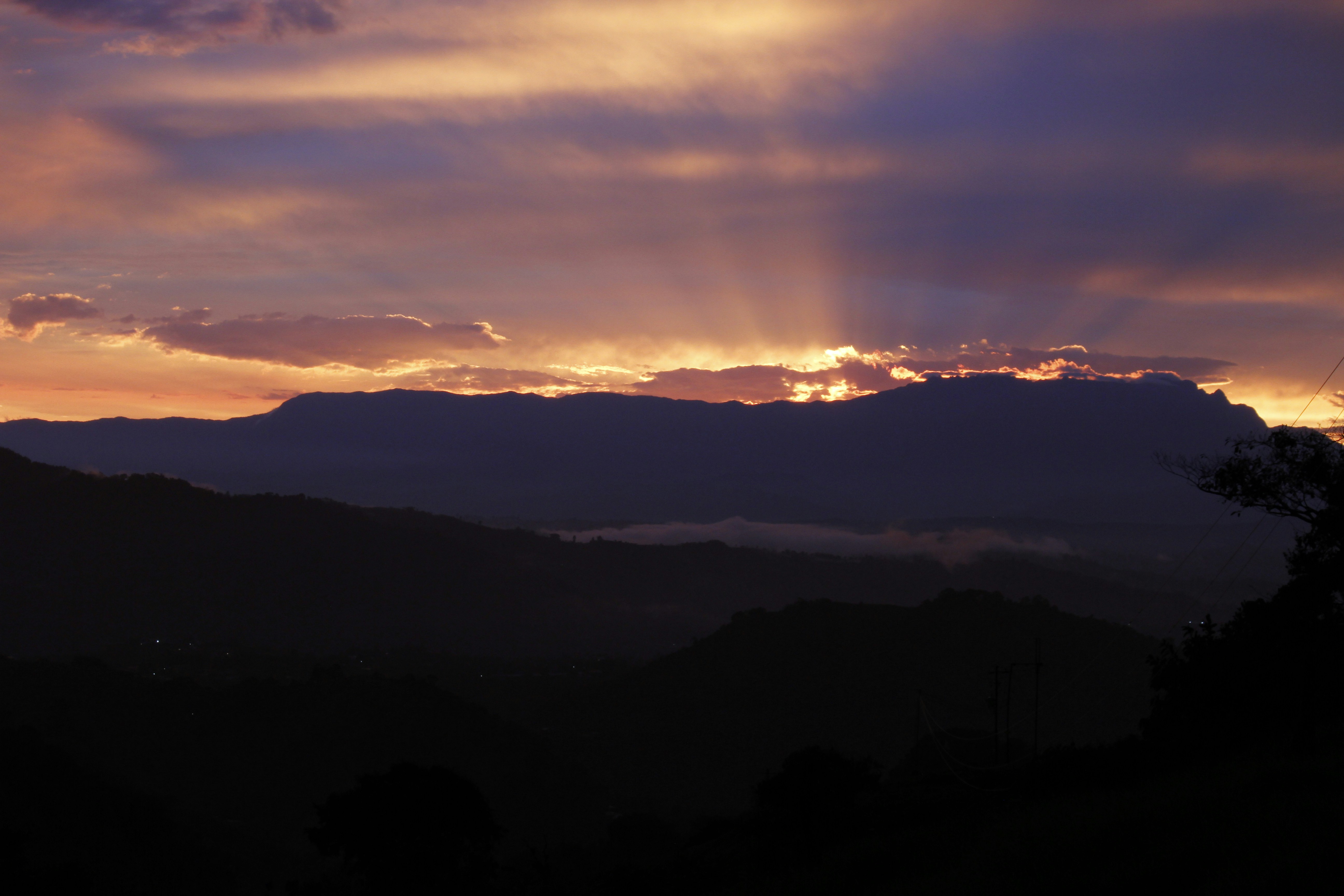 Dawn Breaks Over Layered Hills and Quiet Valleys