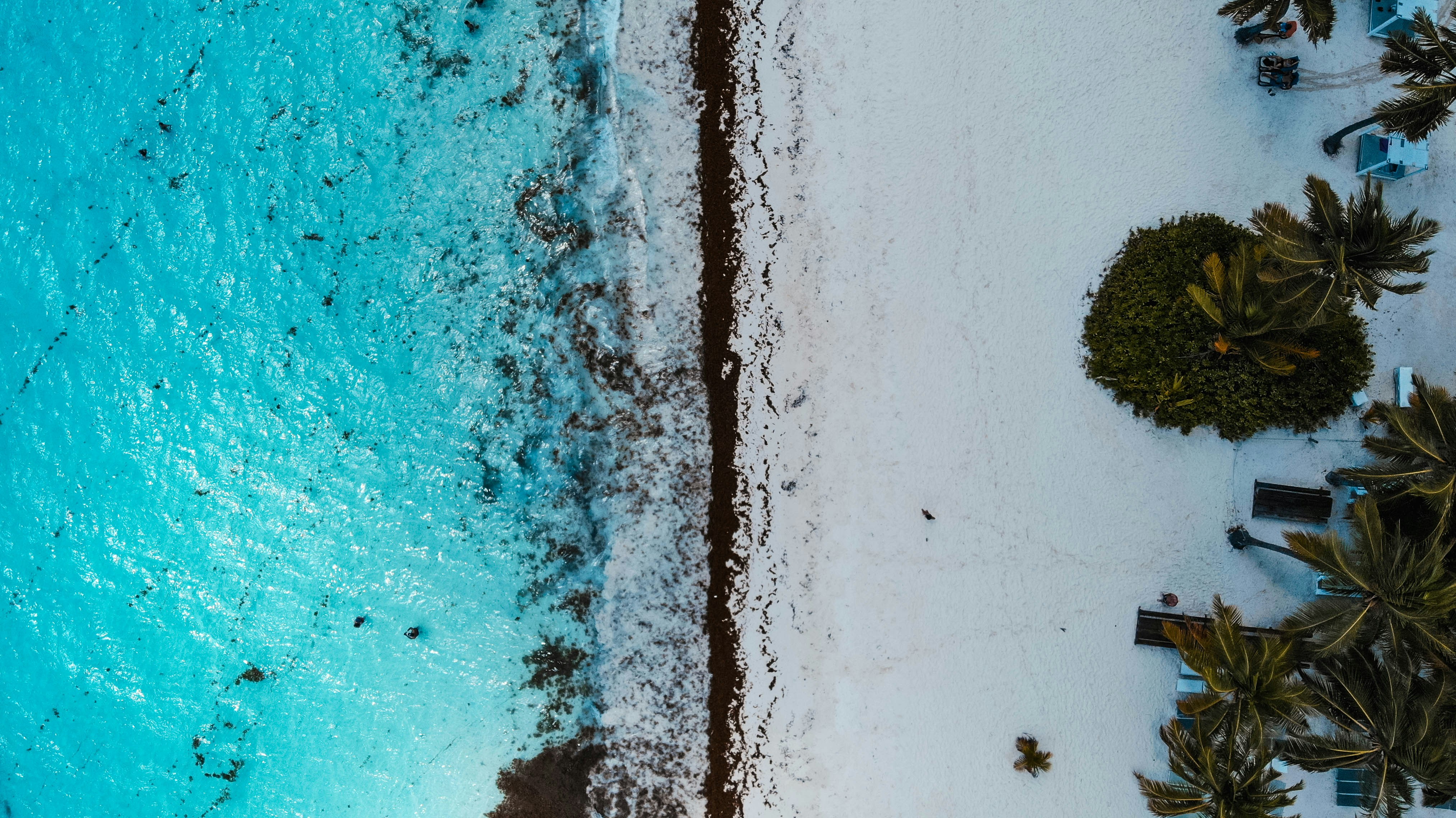 Turquoise Lagoon Meets Snowy Shore: A Drone Portrait of Coastal Contrast