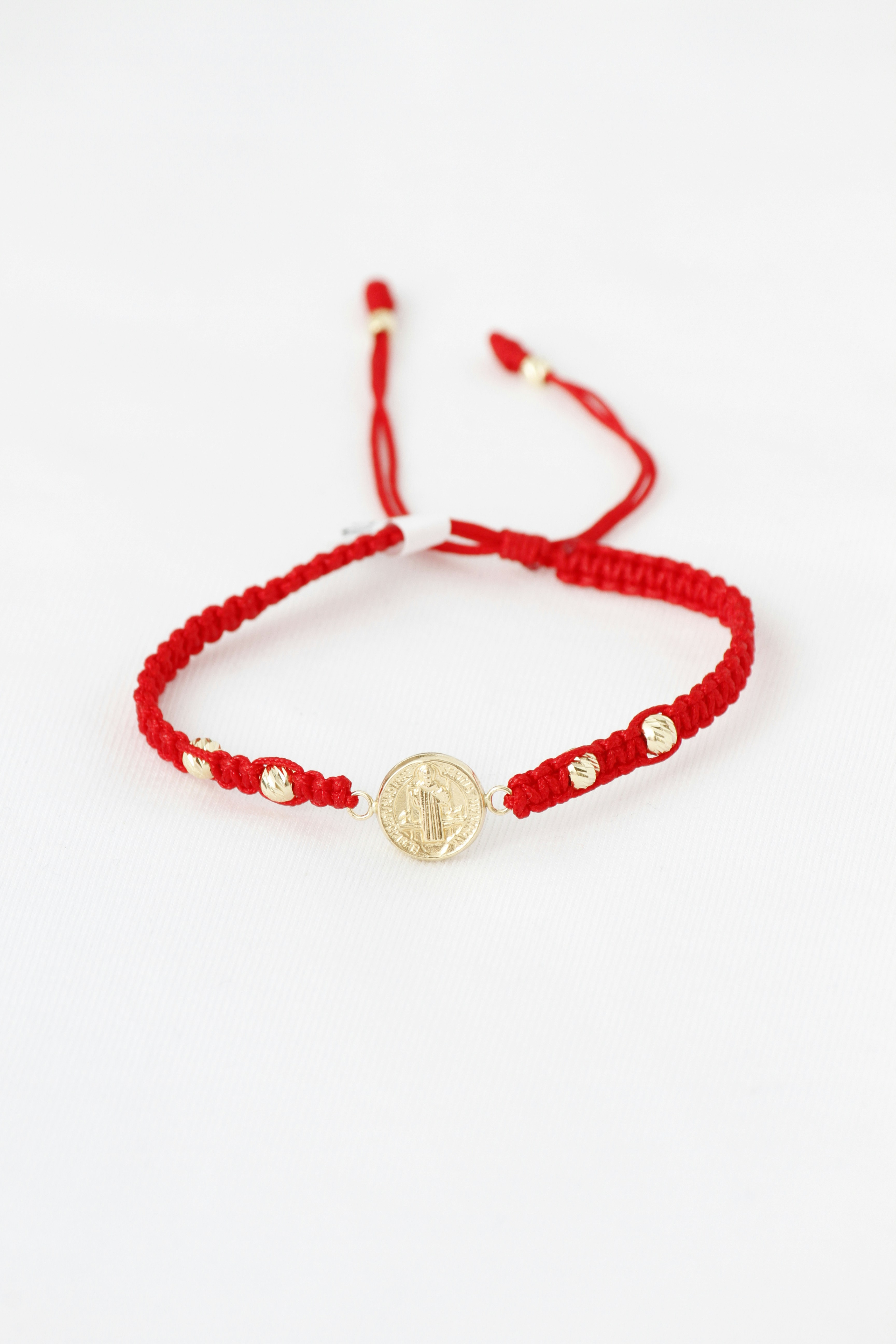 Red Thread of Fortune: Minimal Jewelry on White Canvas
