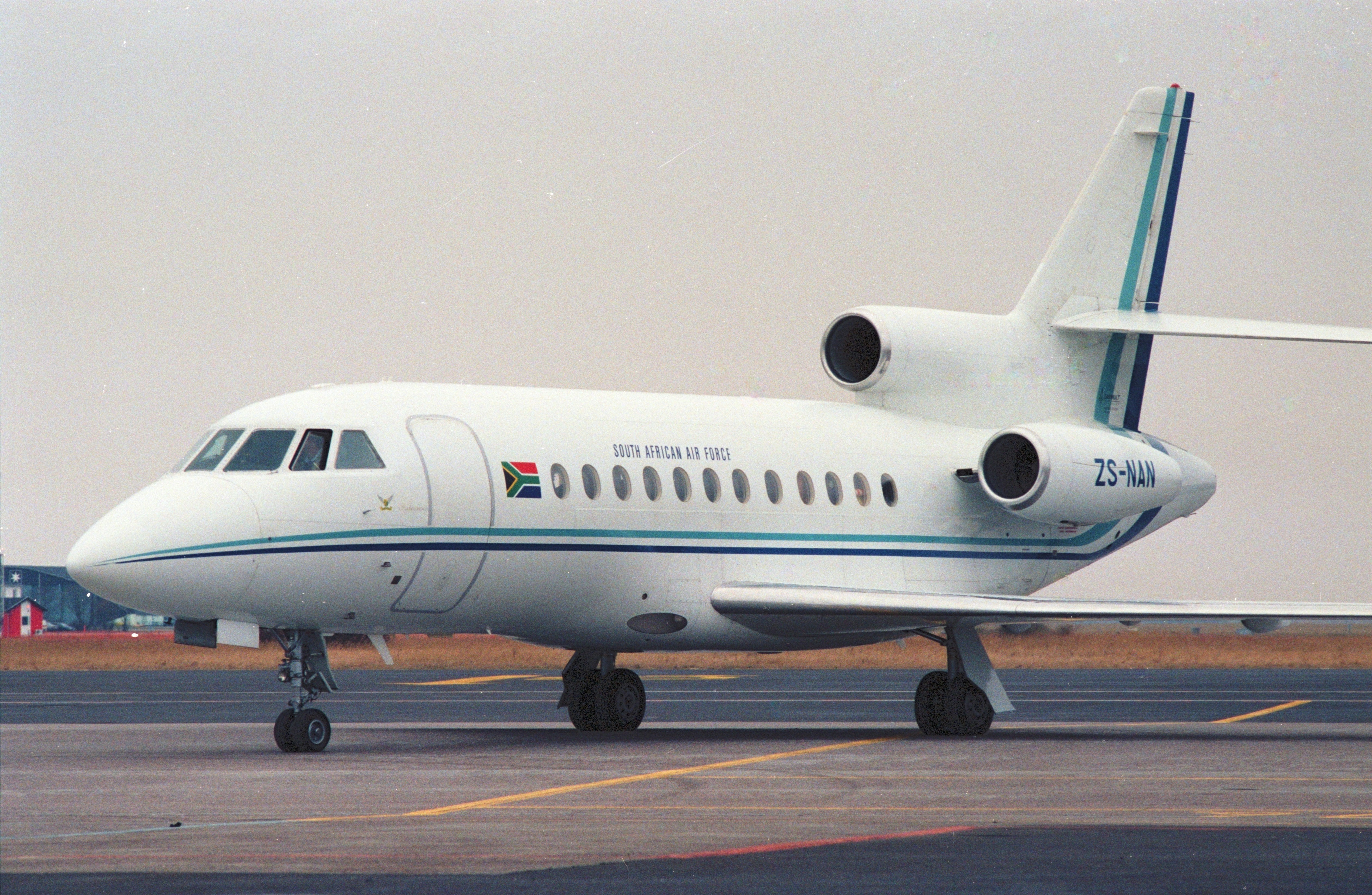 Quiet taxiing: a white twin-engine regional jet on a sunlit tarmac
