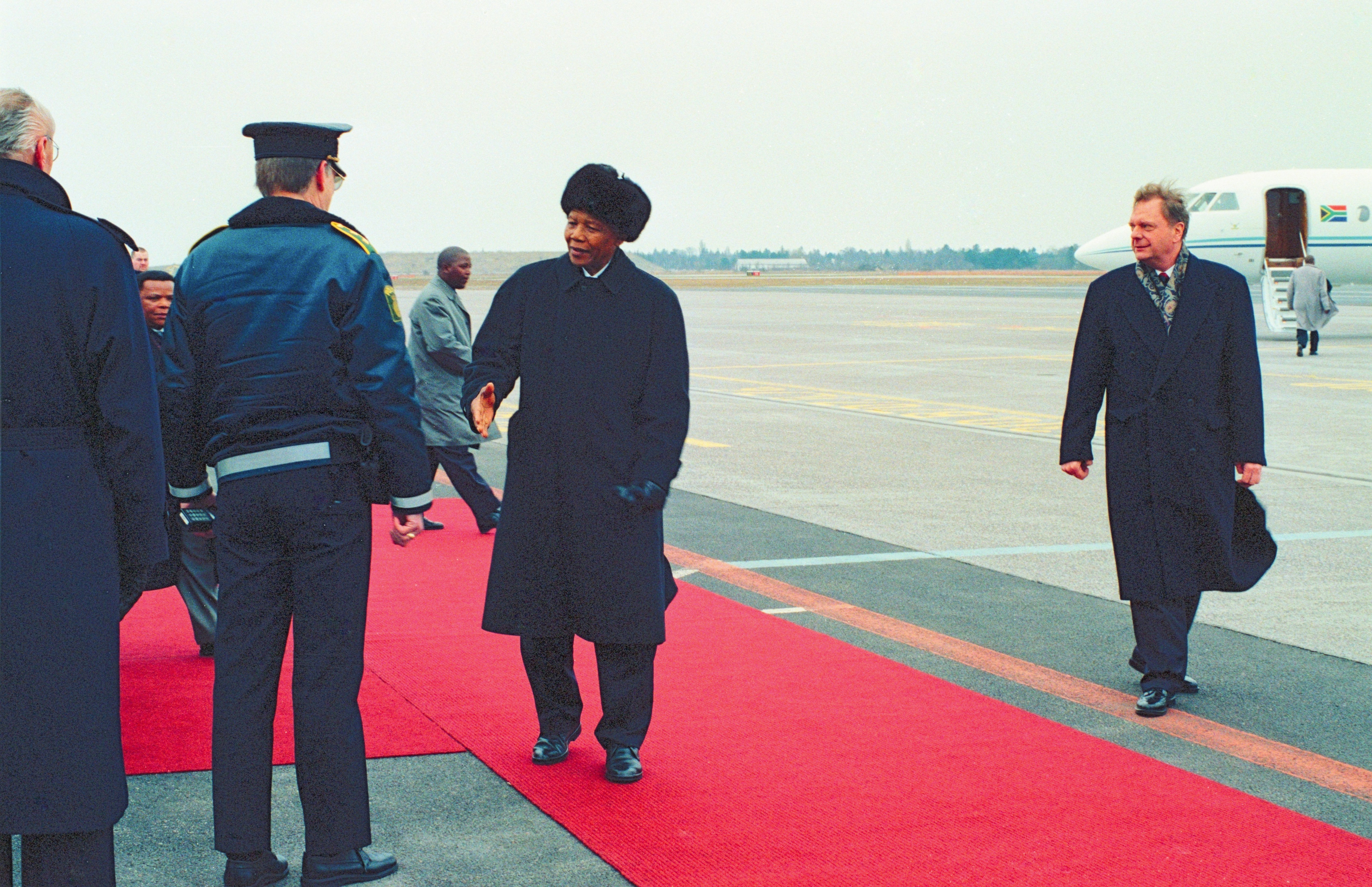 Handshake on the Red Carpet: A Formal Arrival at the Tarmac