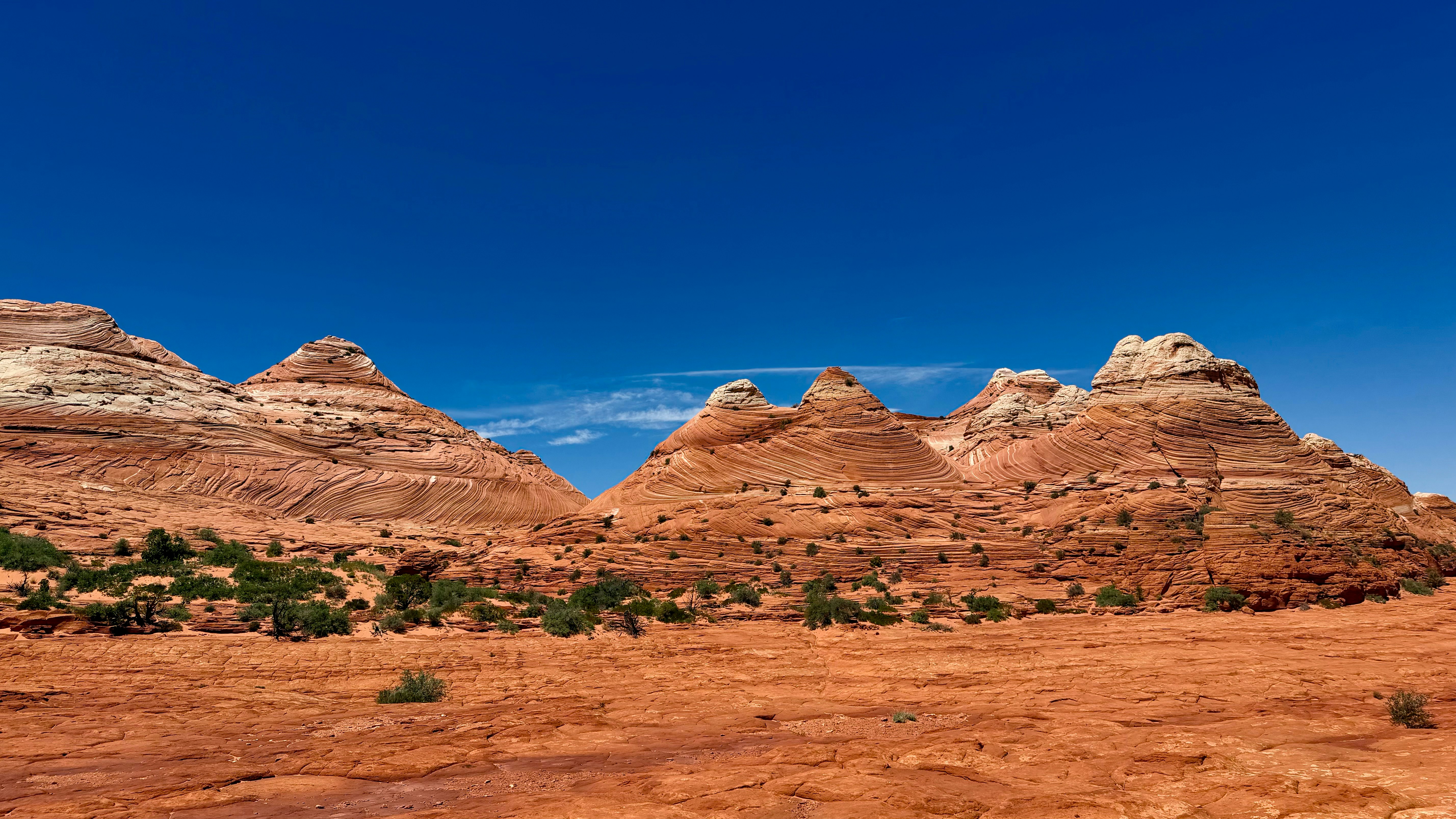 Ridge Line Echoes: Crimson Rock Formations under a Cerulean Sky