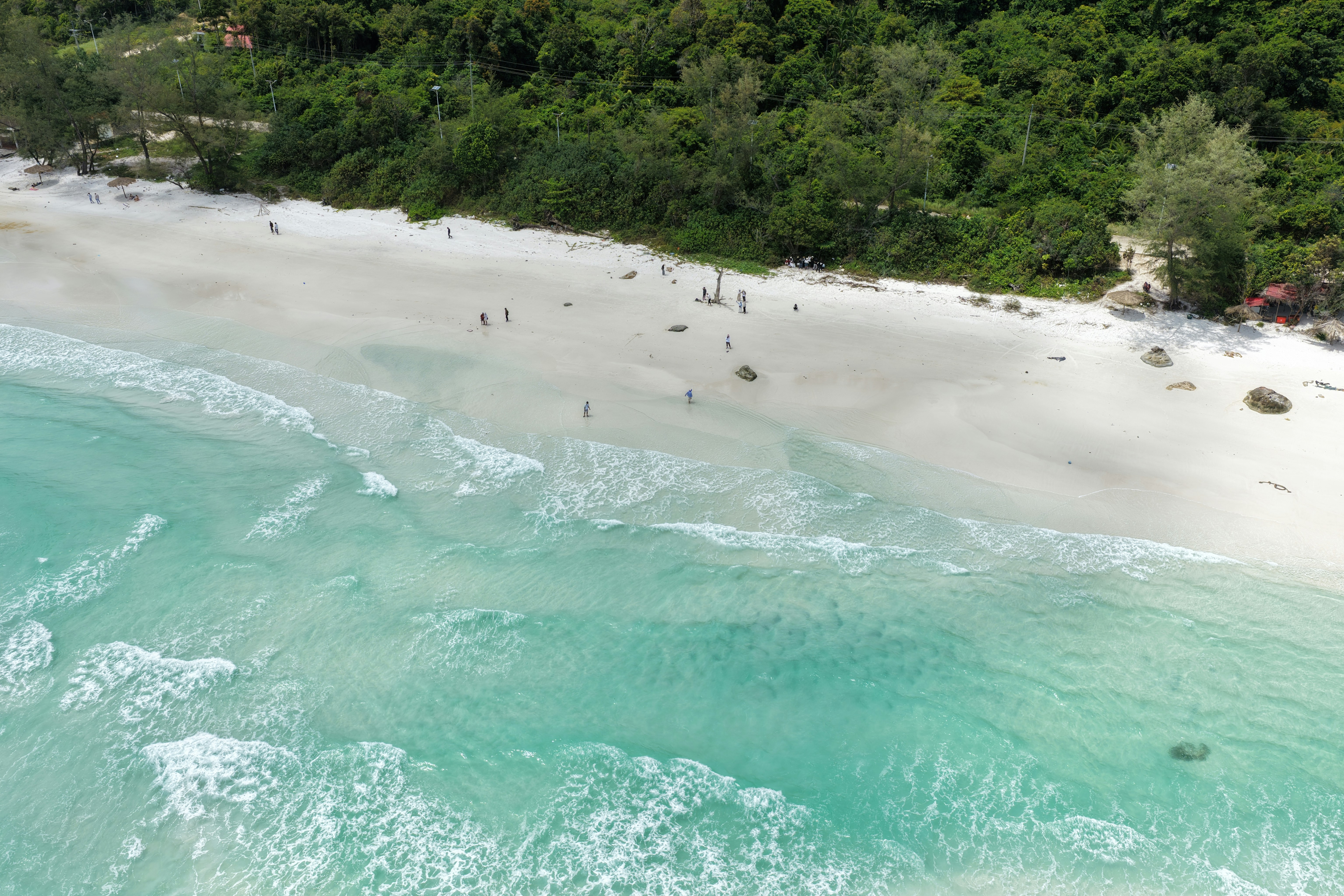 Turquoise Shoreline: Aerial View of a Quiet Tropical Beach