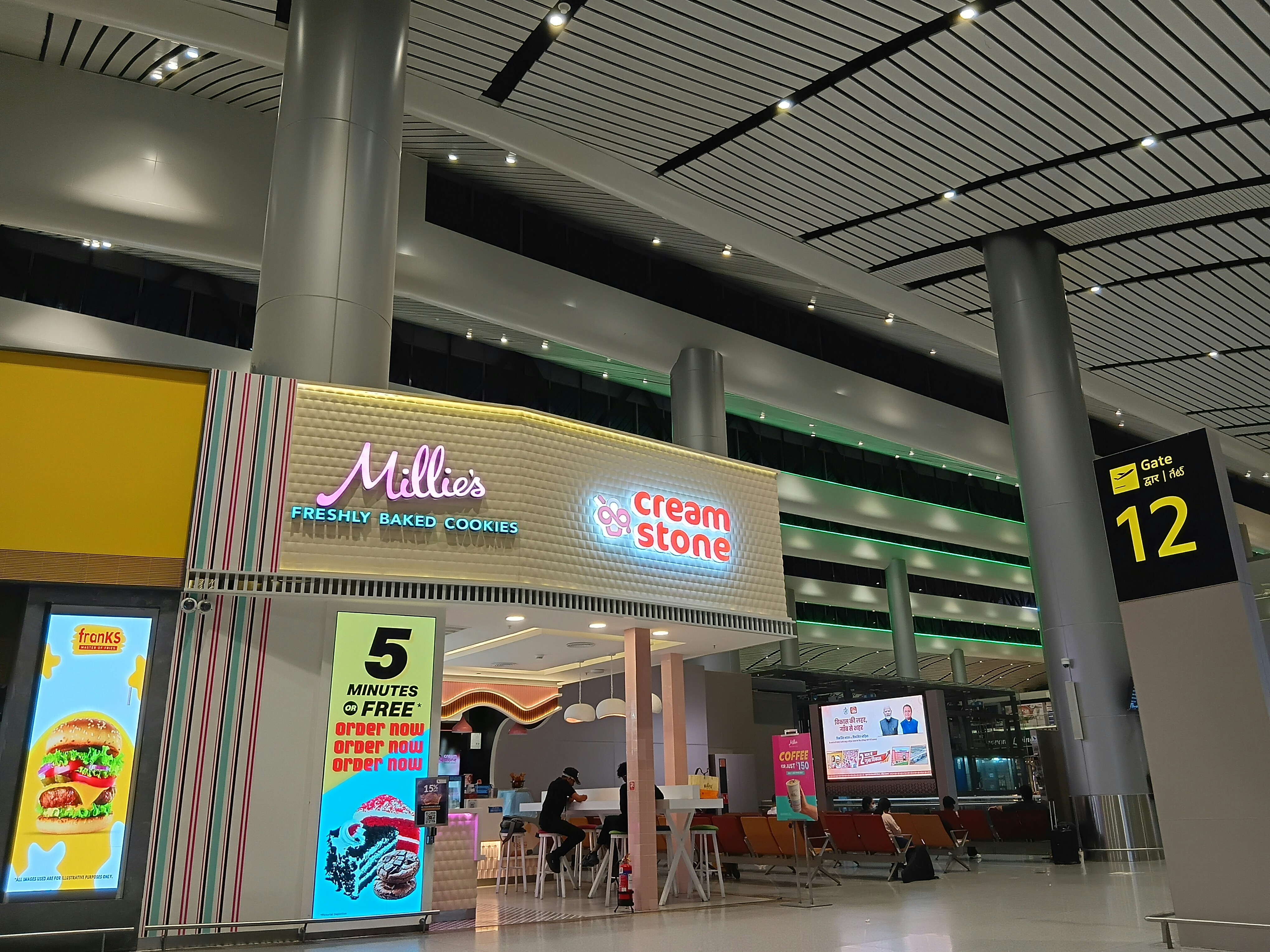 Millie's cookies and cream stone store inside a modern airport.