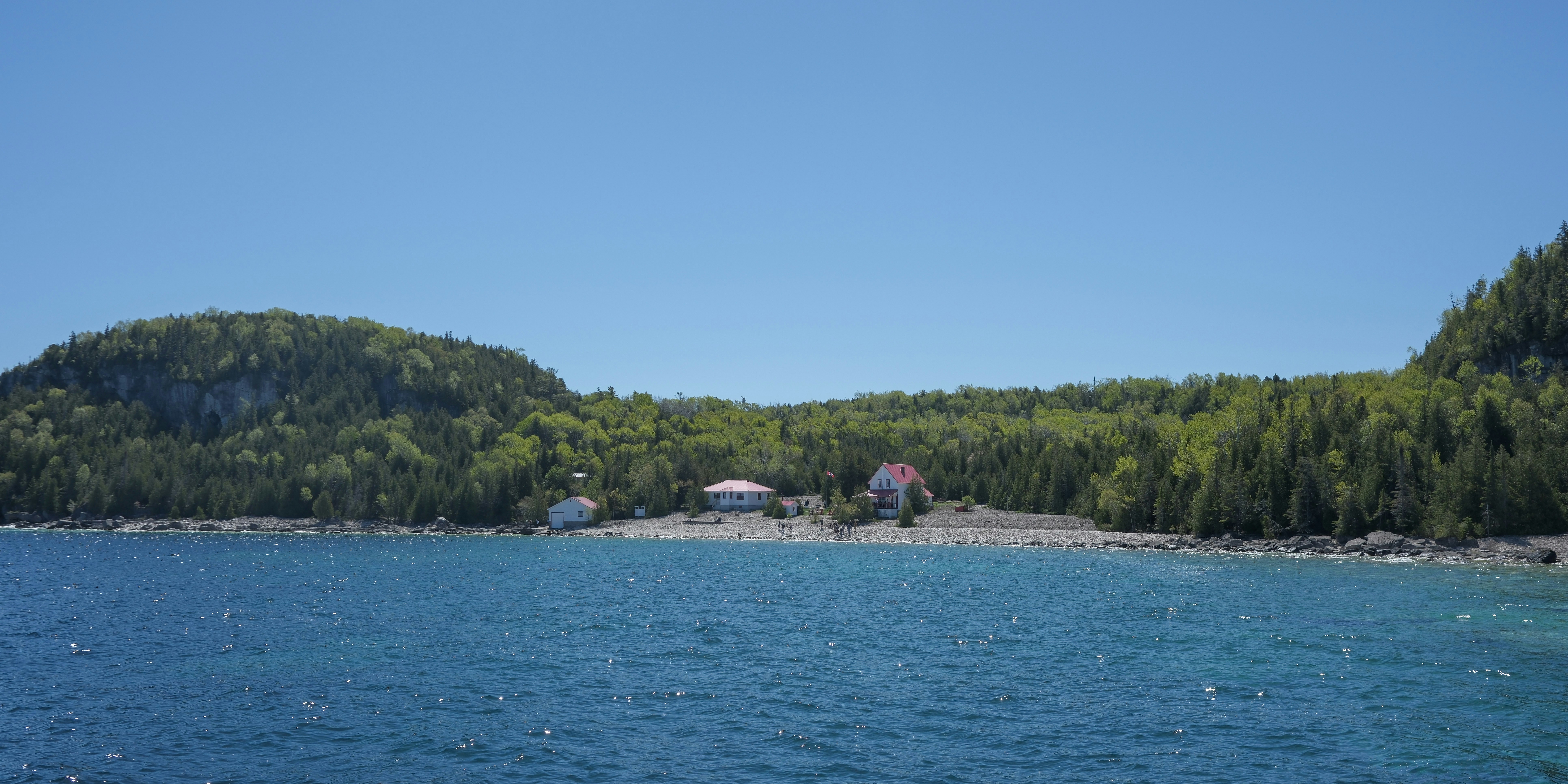 Coastal Cabin Line Under a Blue Sky