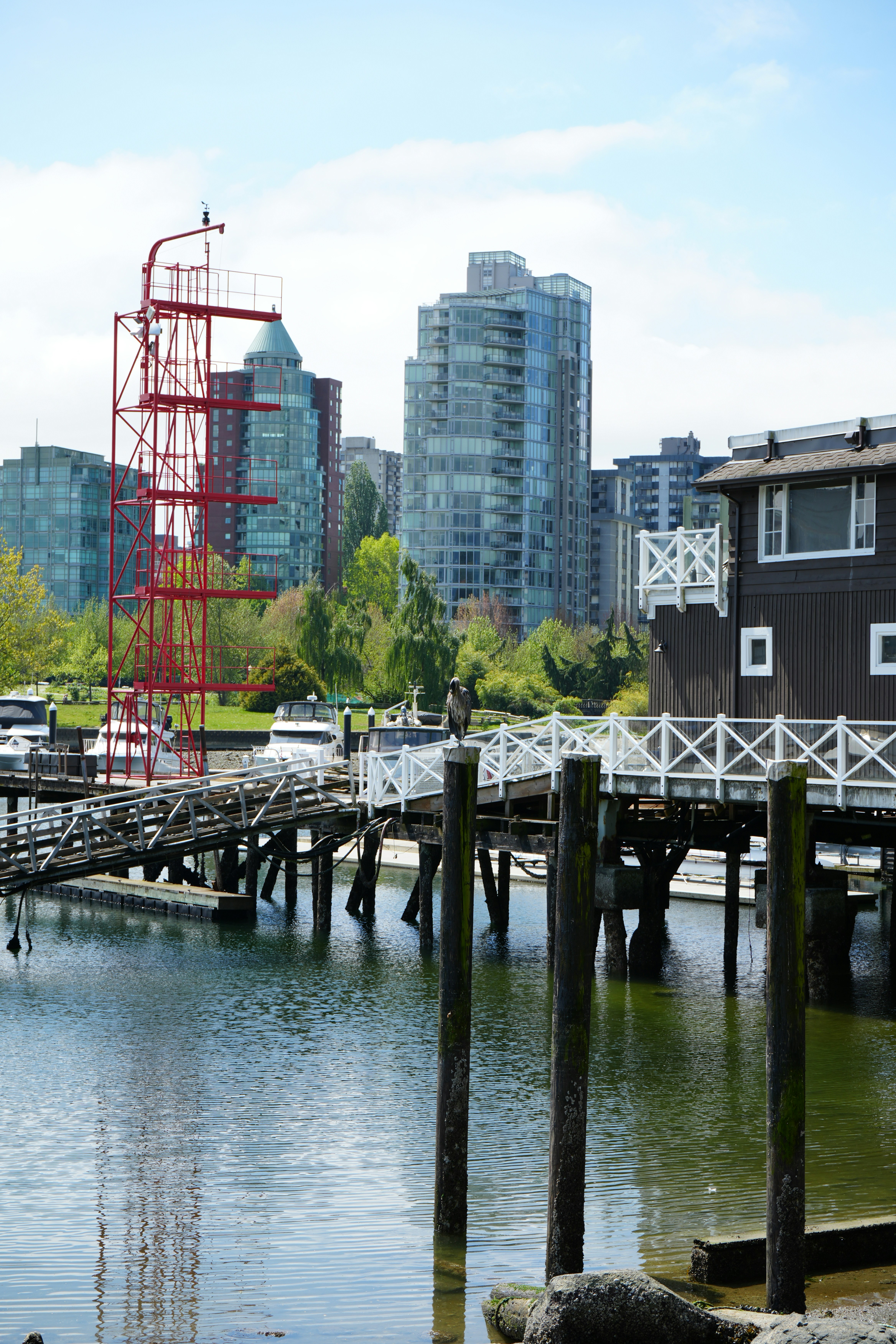 Pierfront City: A Red Tower, White Railings, and Glass Skyscrapers
