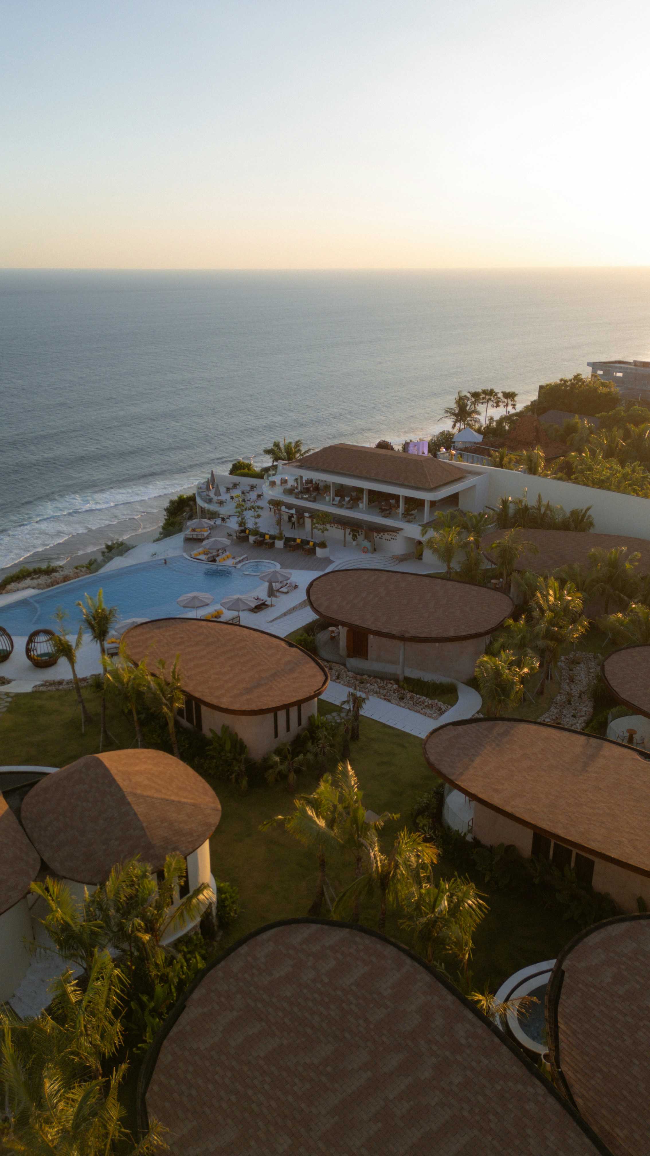Oceanfront Resort Aerial: Sunset Light Over Rooftops and Pools