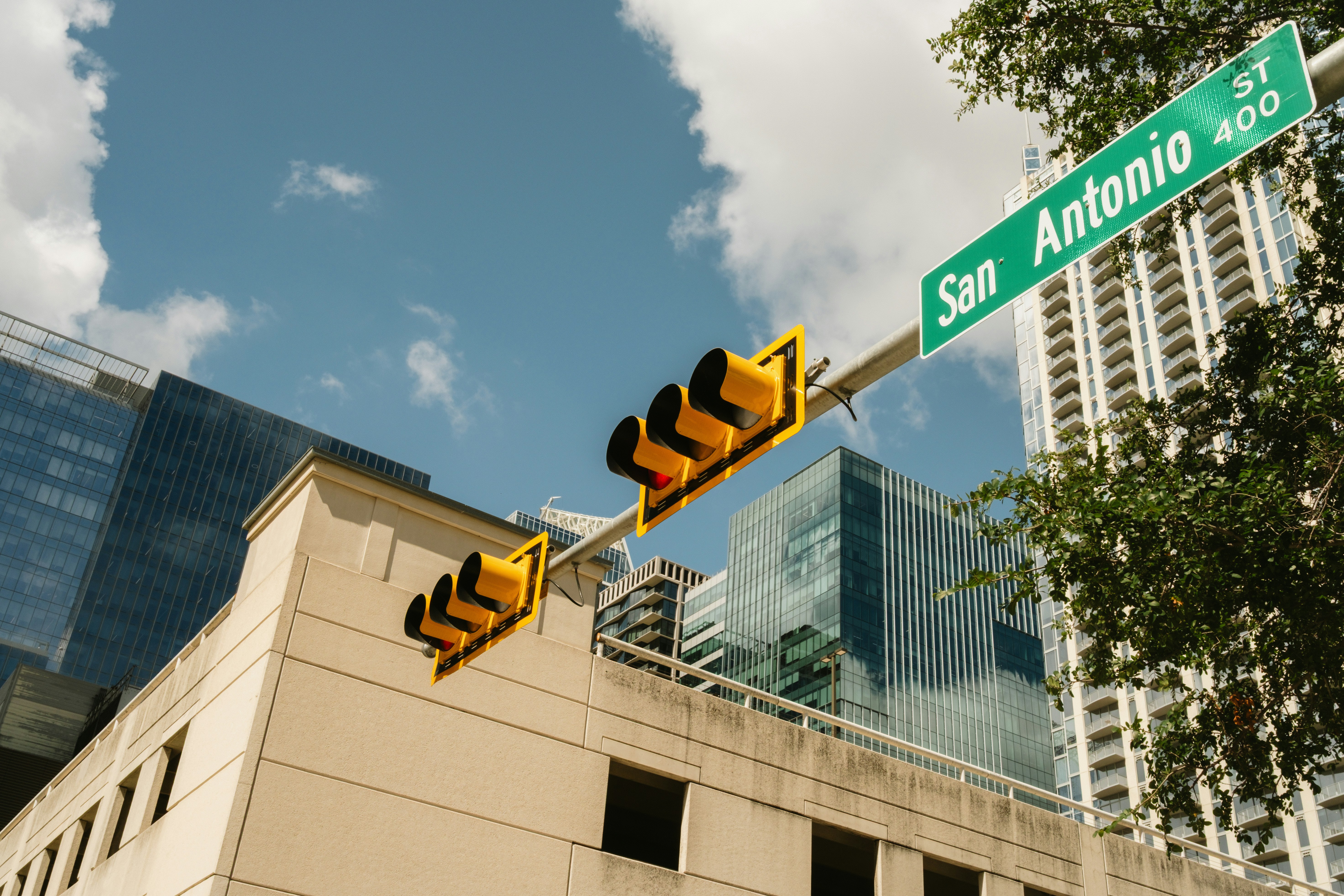 San antonio street sign, traffic lights, and city buildings