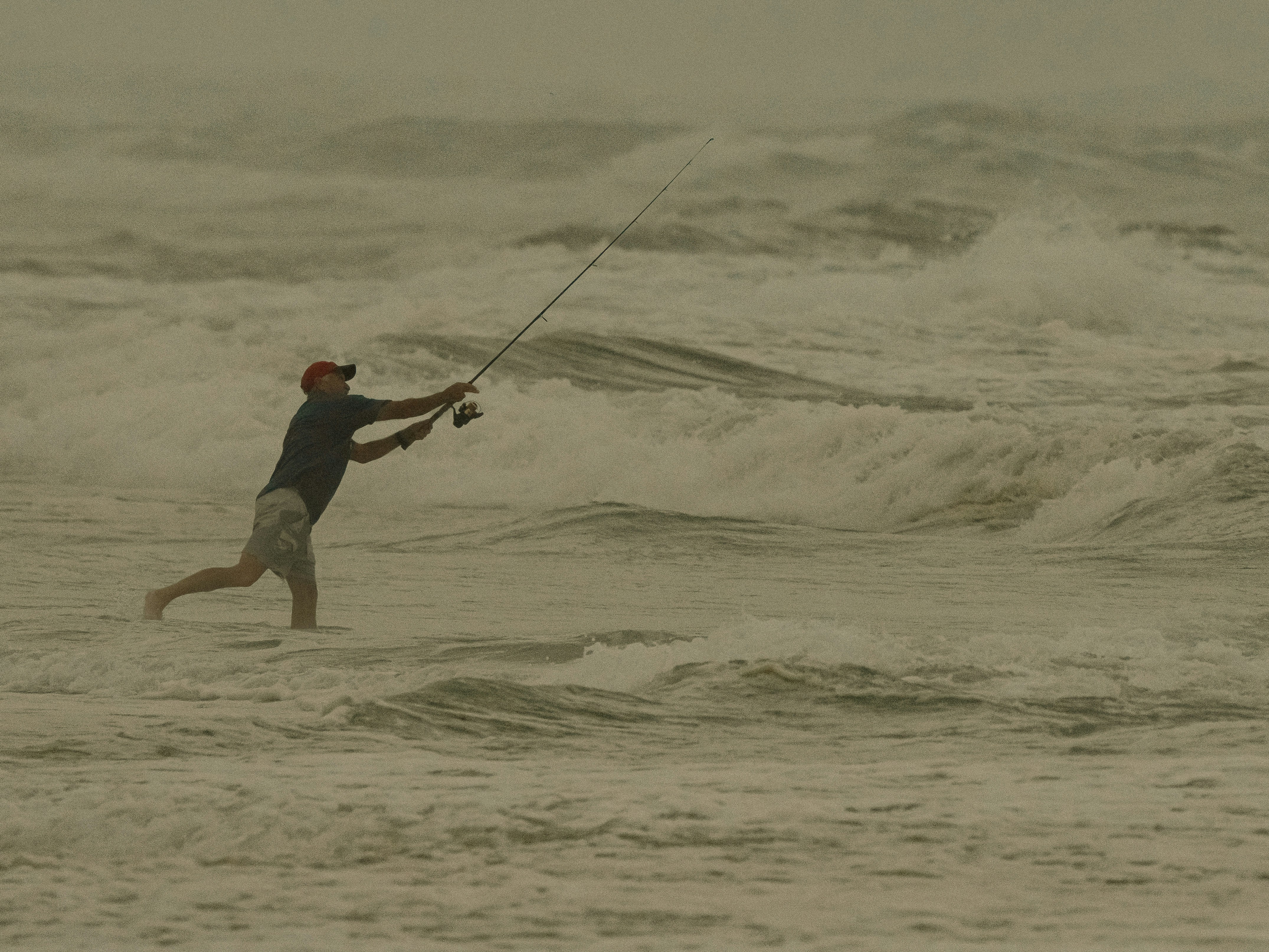 Tug of Wind: The Angler Fights the Sea