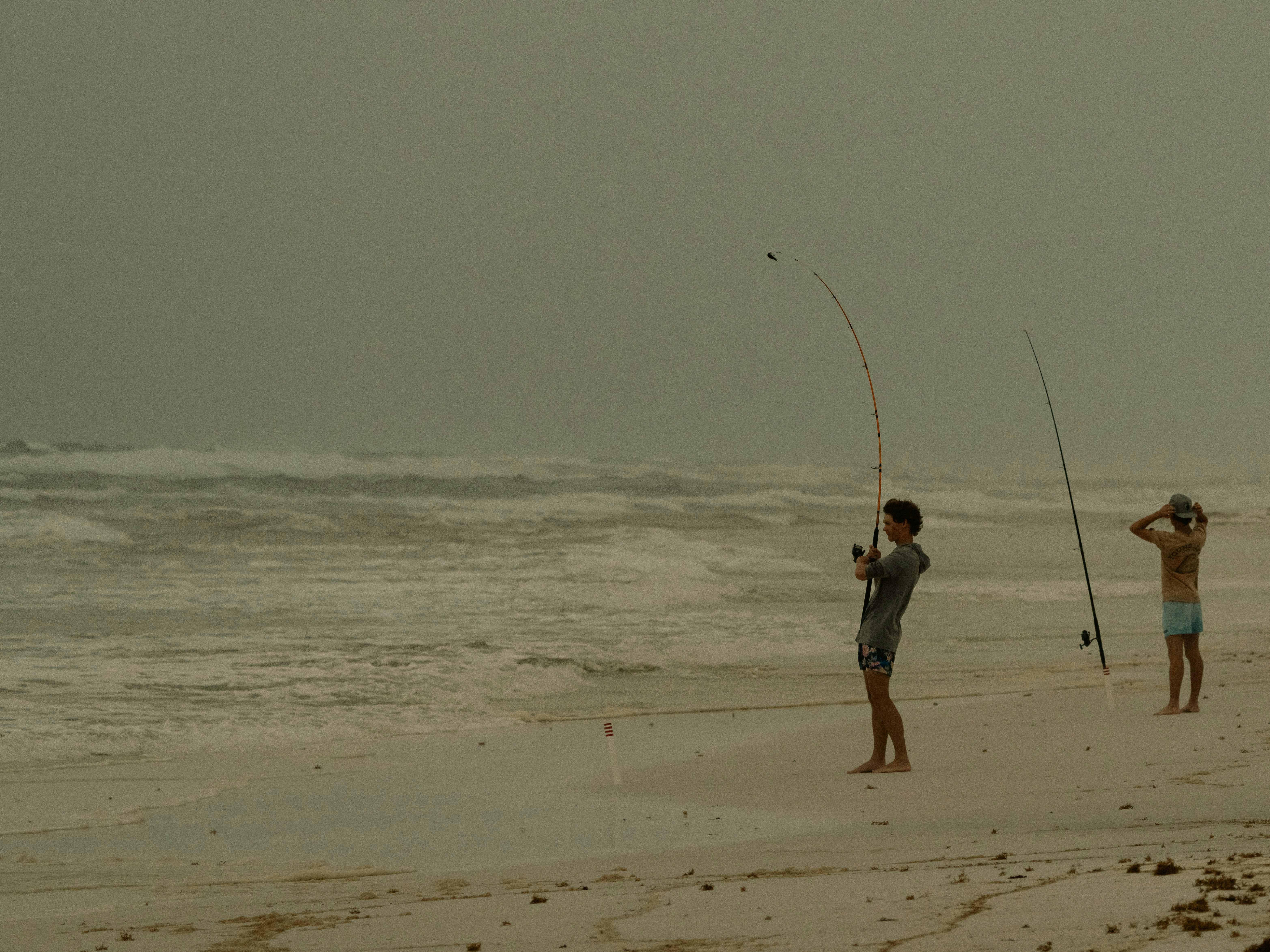 Chord of the Tide: Dual Anglers at Dusk