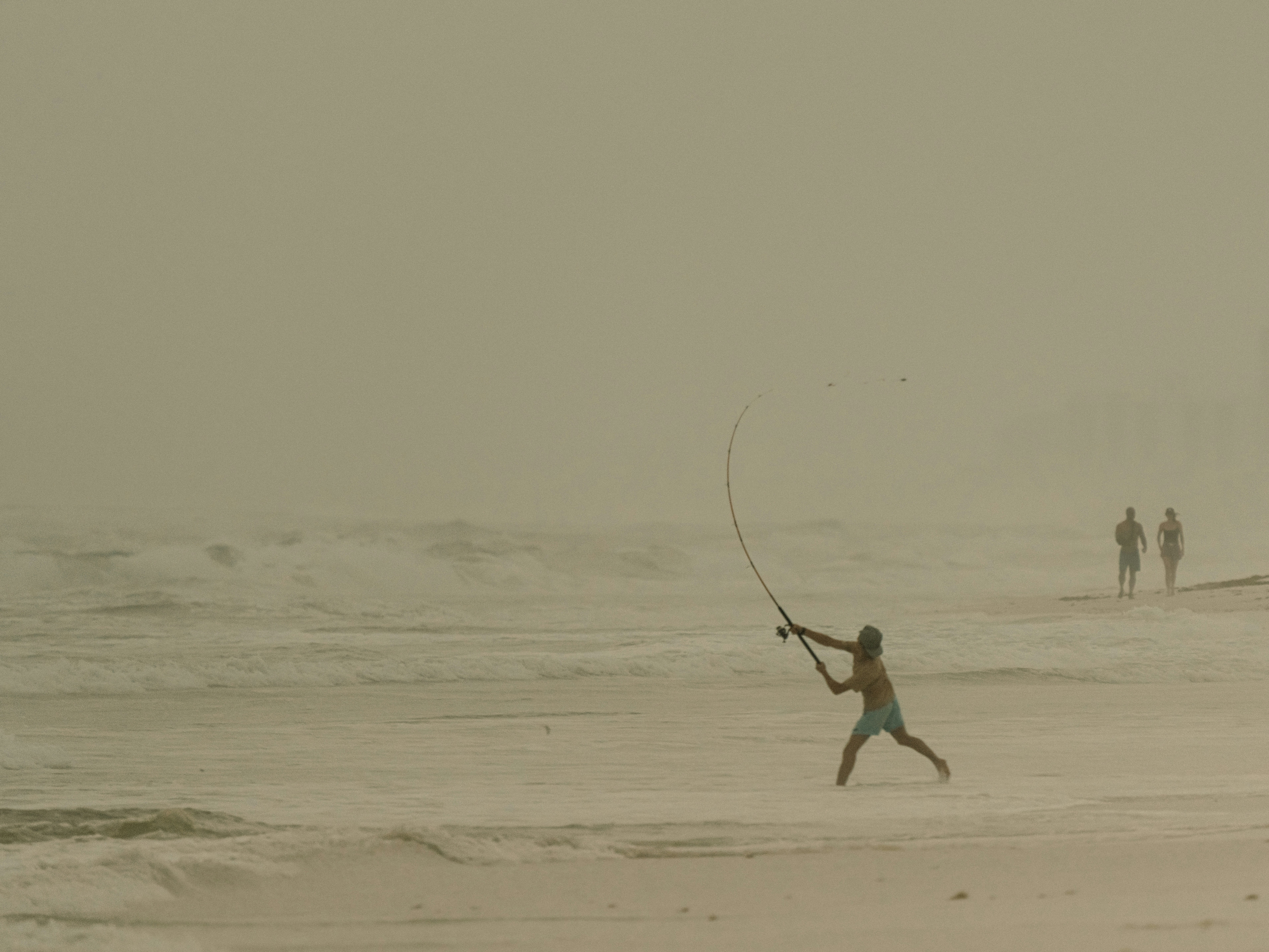 Kite-arc over a hazy shoreline