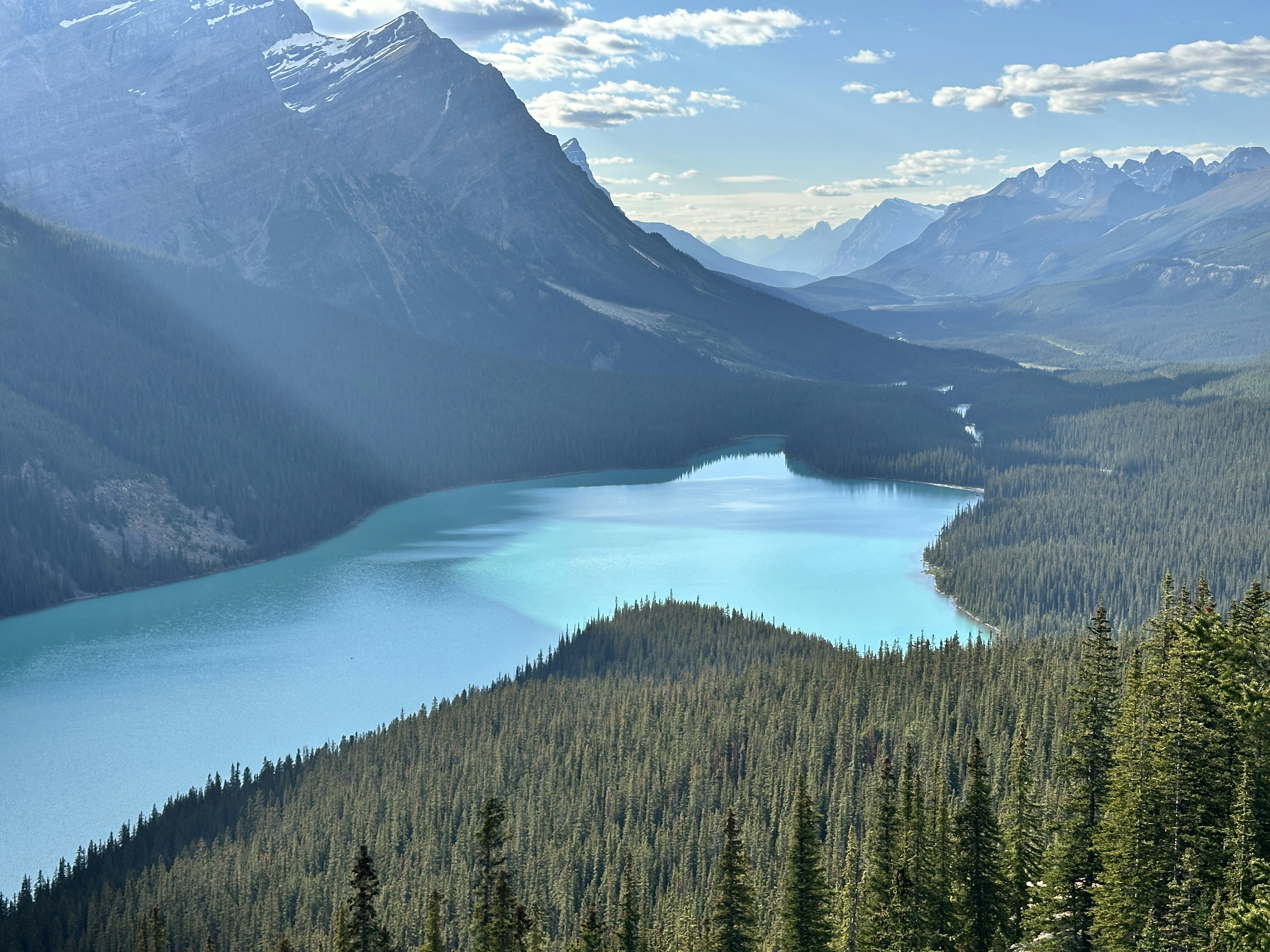 Glacial Turquoise: A Valley of Still Waters Between Snowlit Peaks