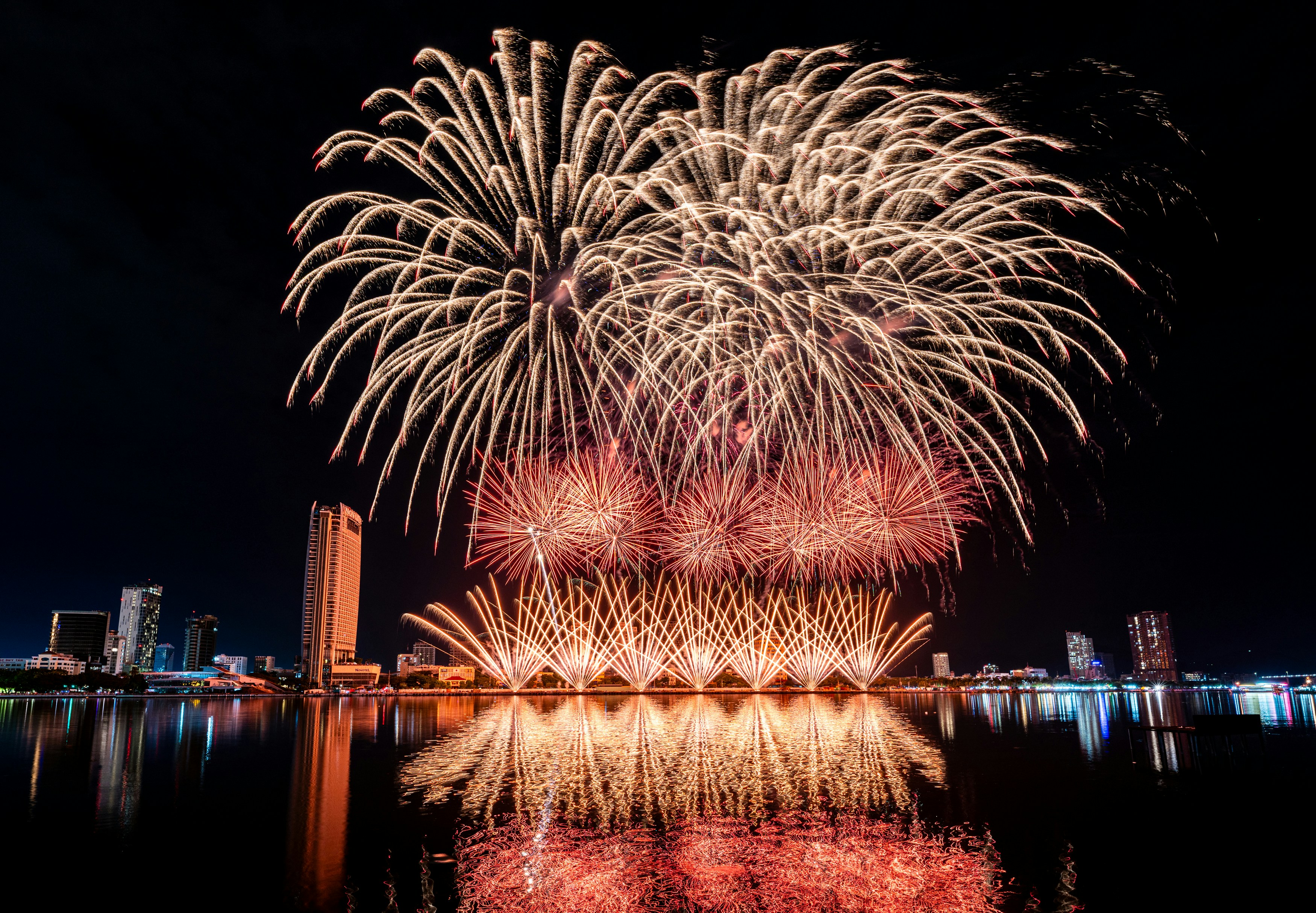Midnight Skyburst Over Riverside Reflections