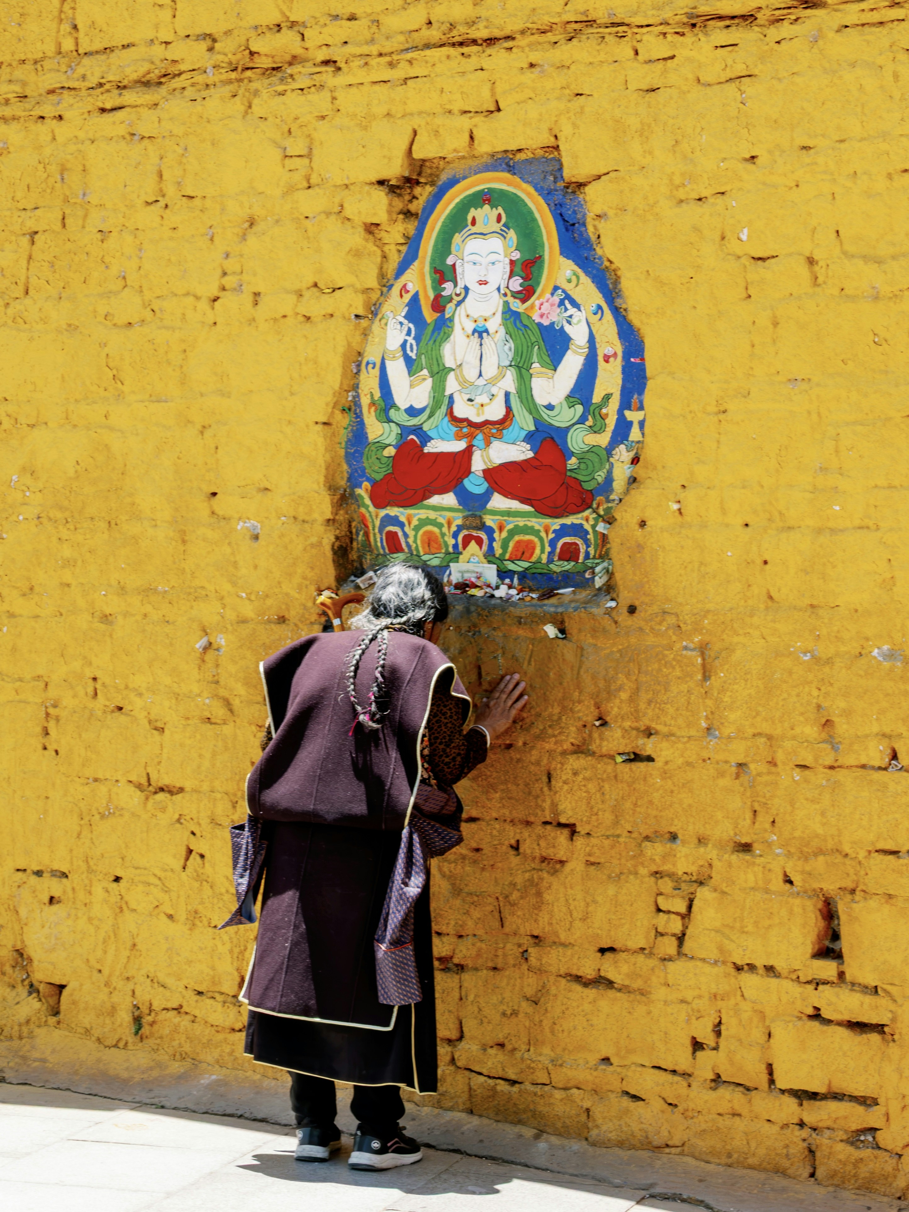 Devout Gesture at a Sunlit Shrine