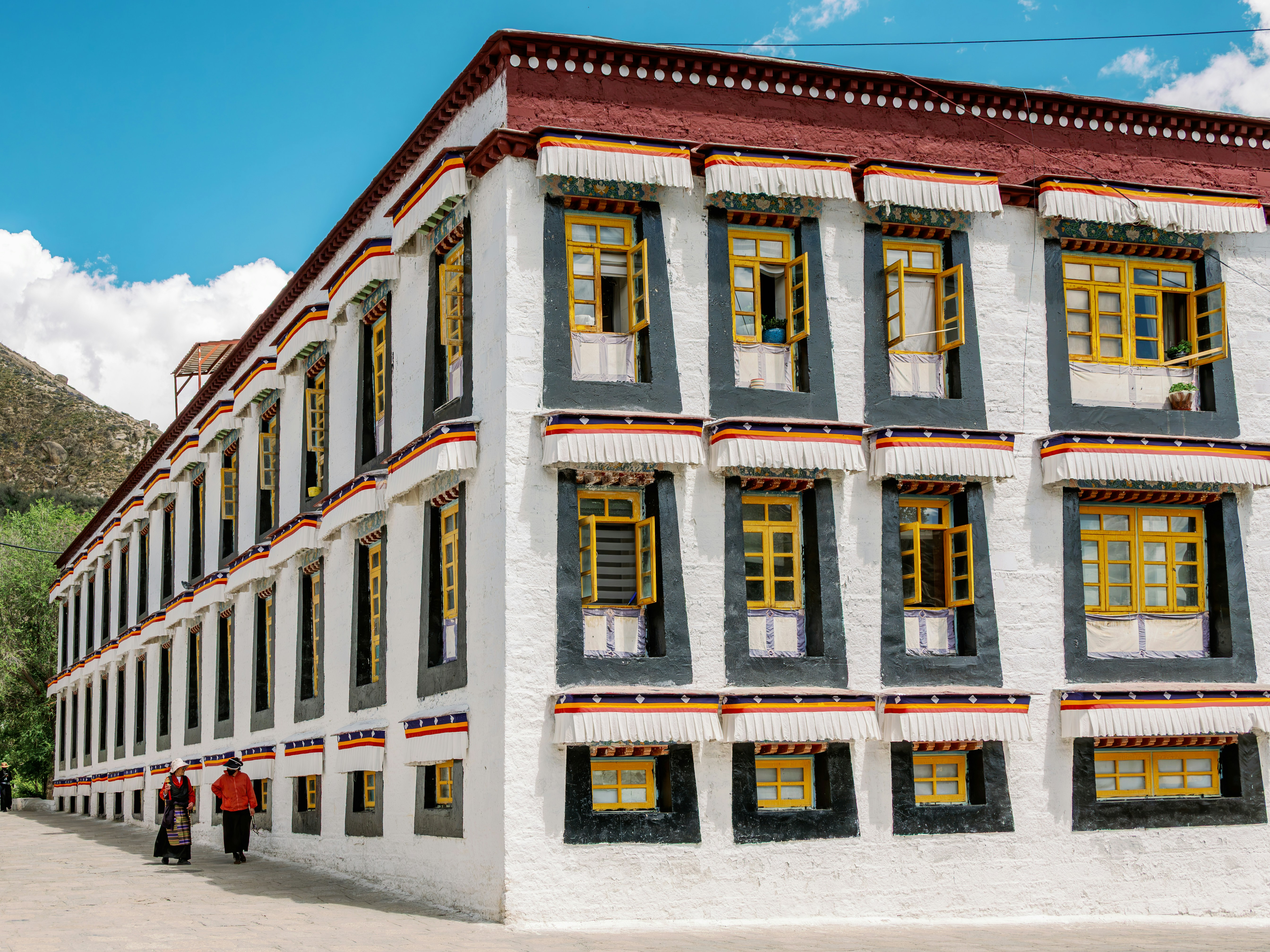 The Whitewashed Facade: Window Grid and Awaned Roofline