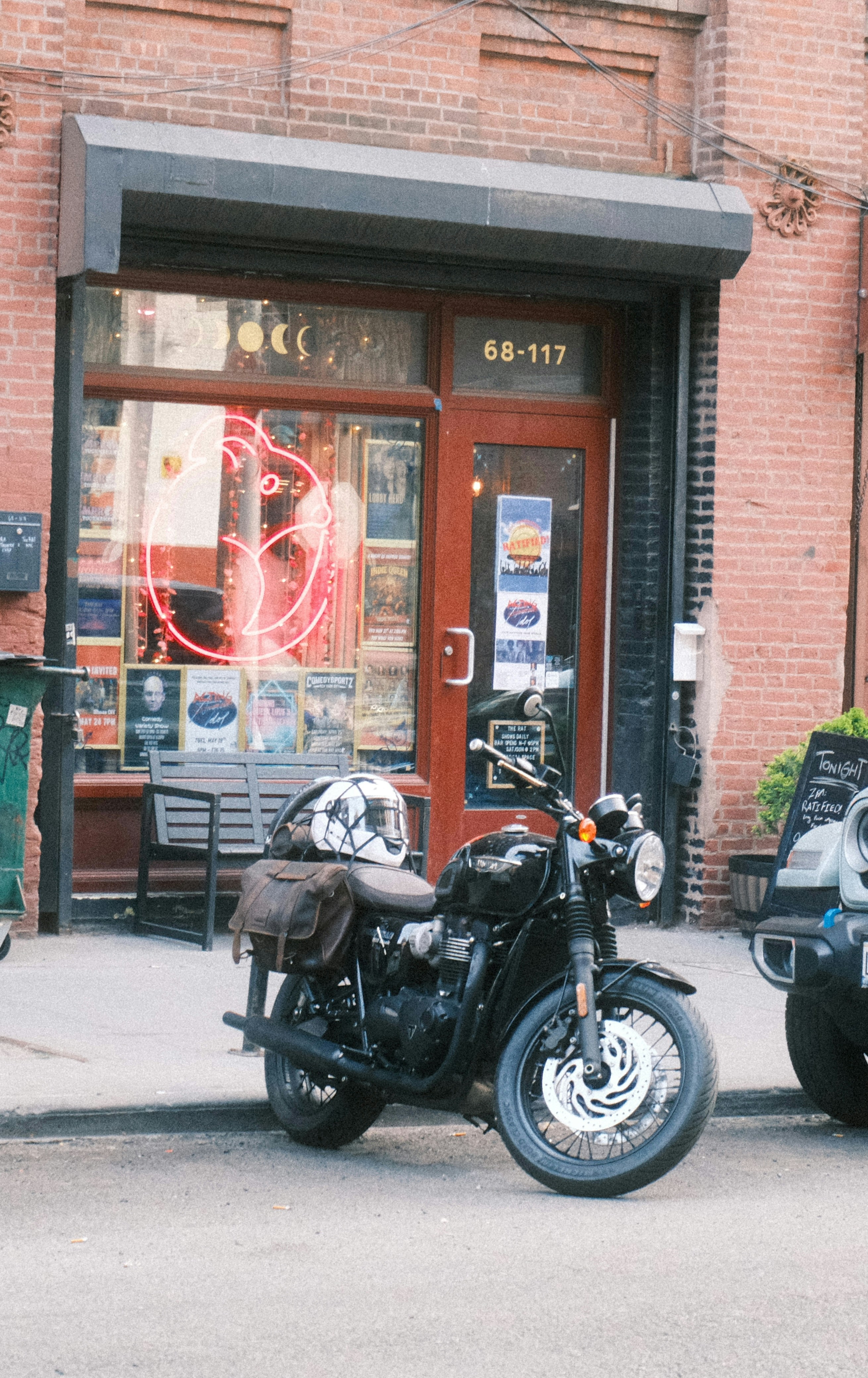 Neon glow and chrome on a street-side motorcycle scene