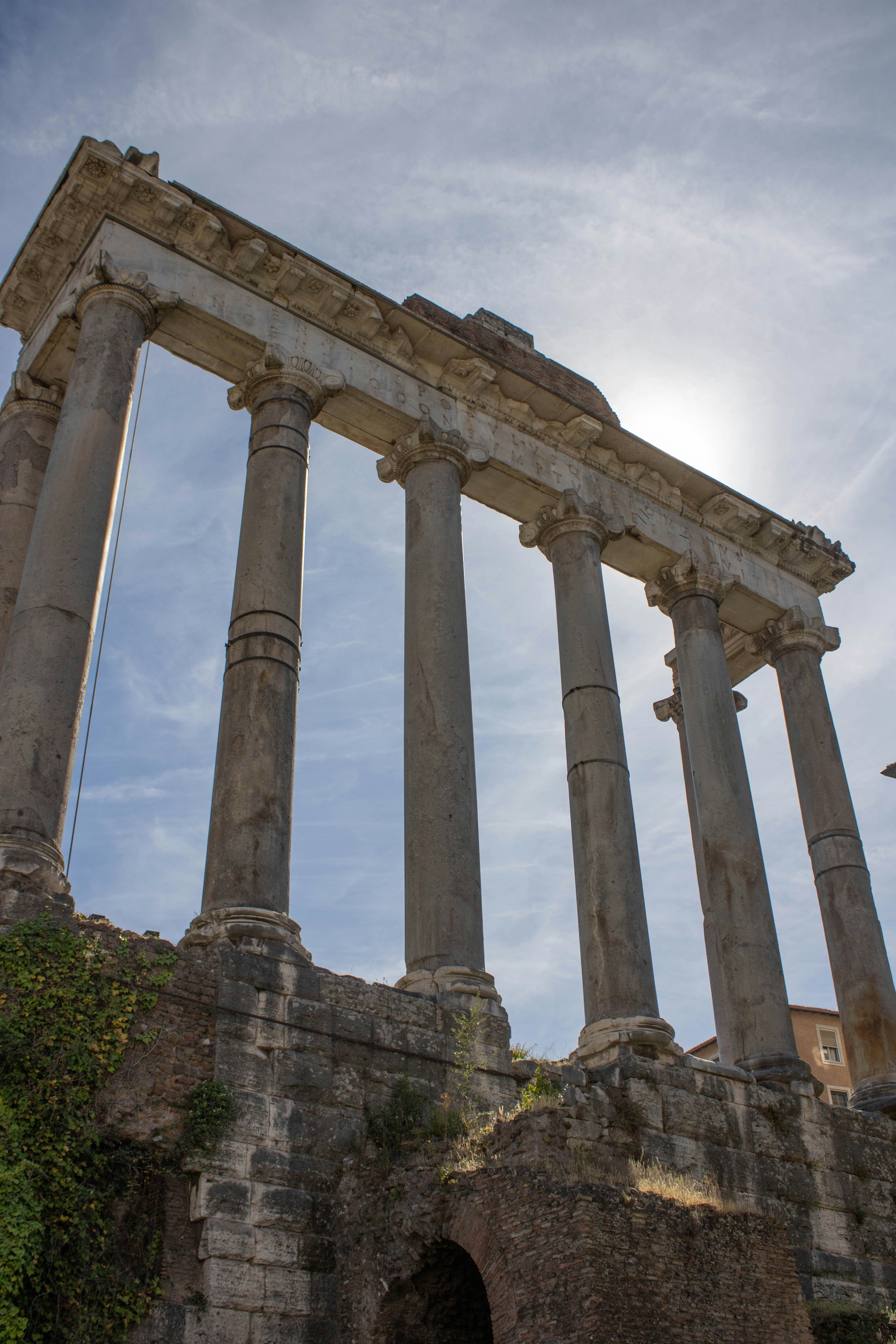 Stone Ruins Under a Clear Sky: A Row of Time-Worn Columns