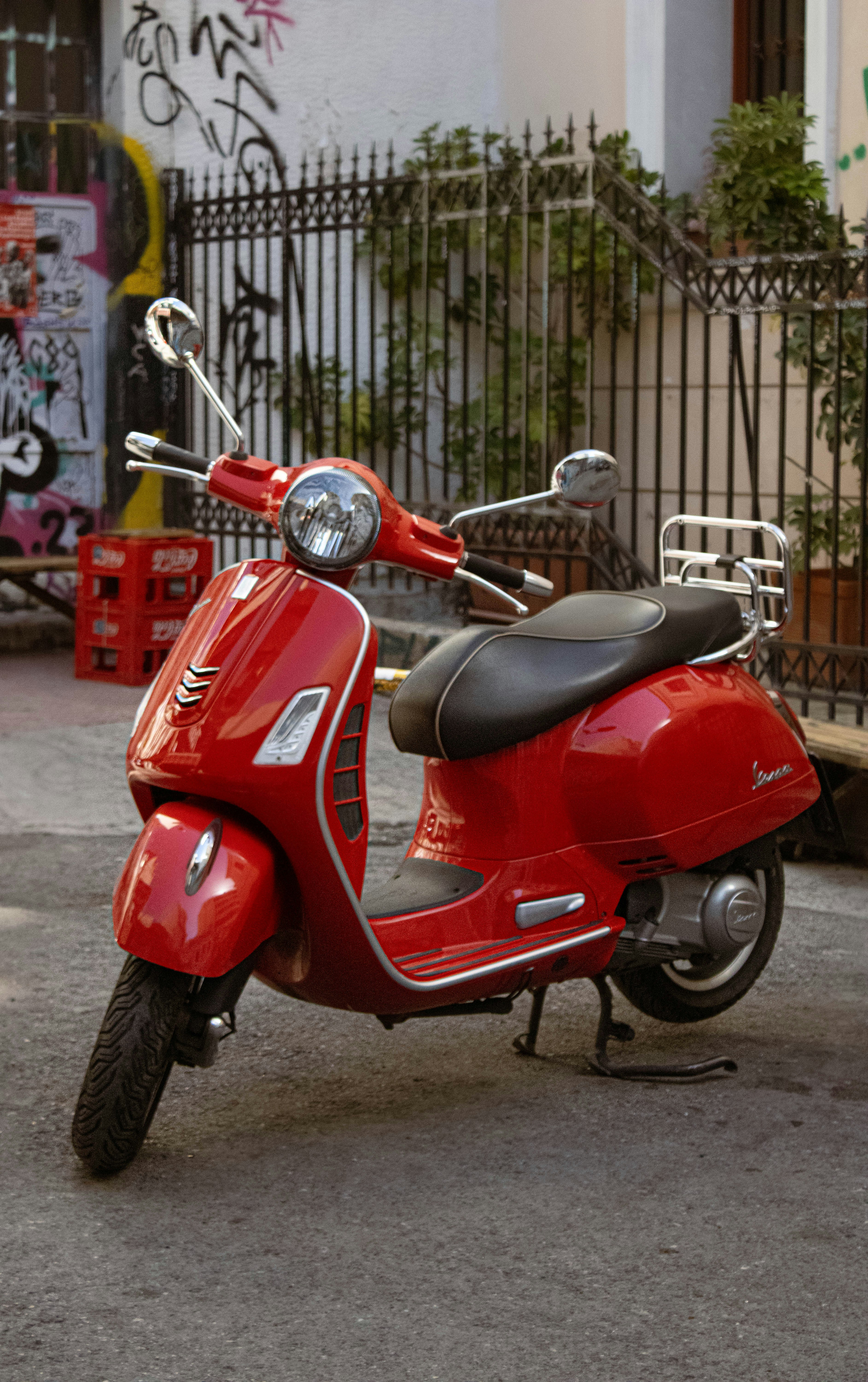 Red Vespa Resting in an Urban Alley