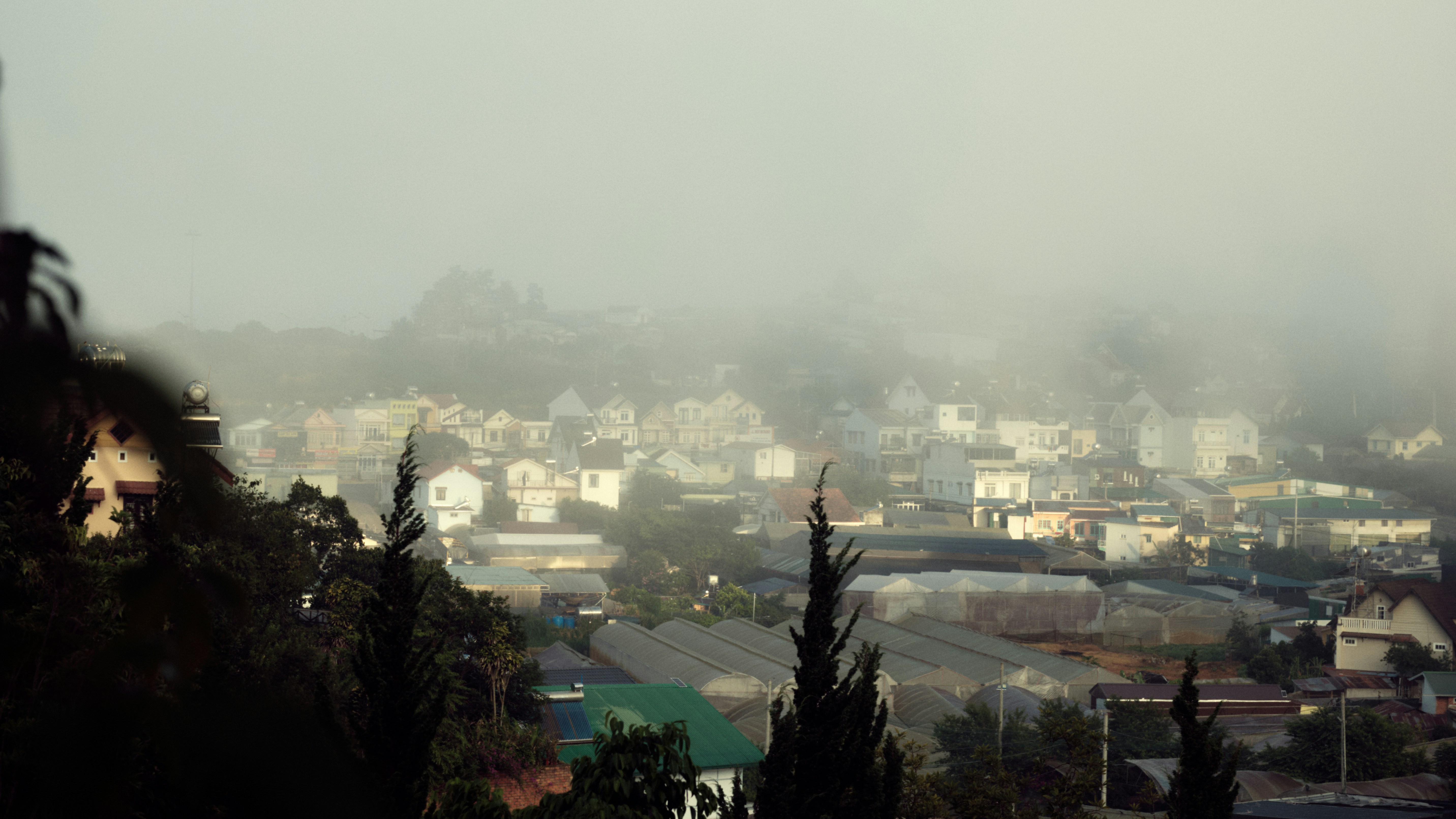Mist over a Quiet Town: Dawn Veiling the Hills