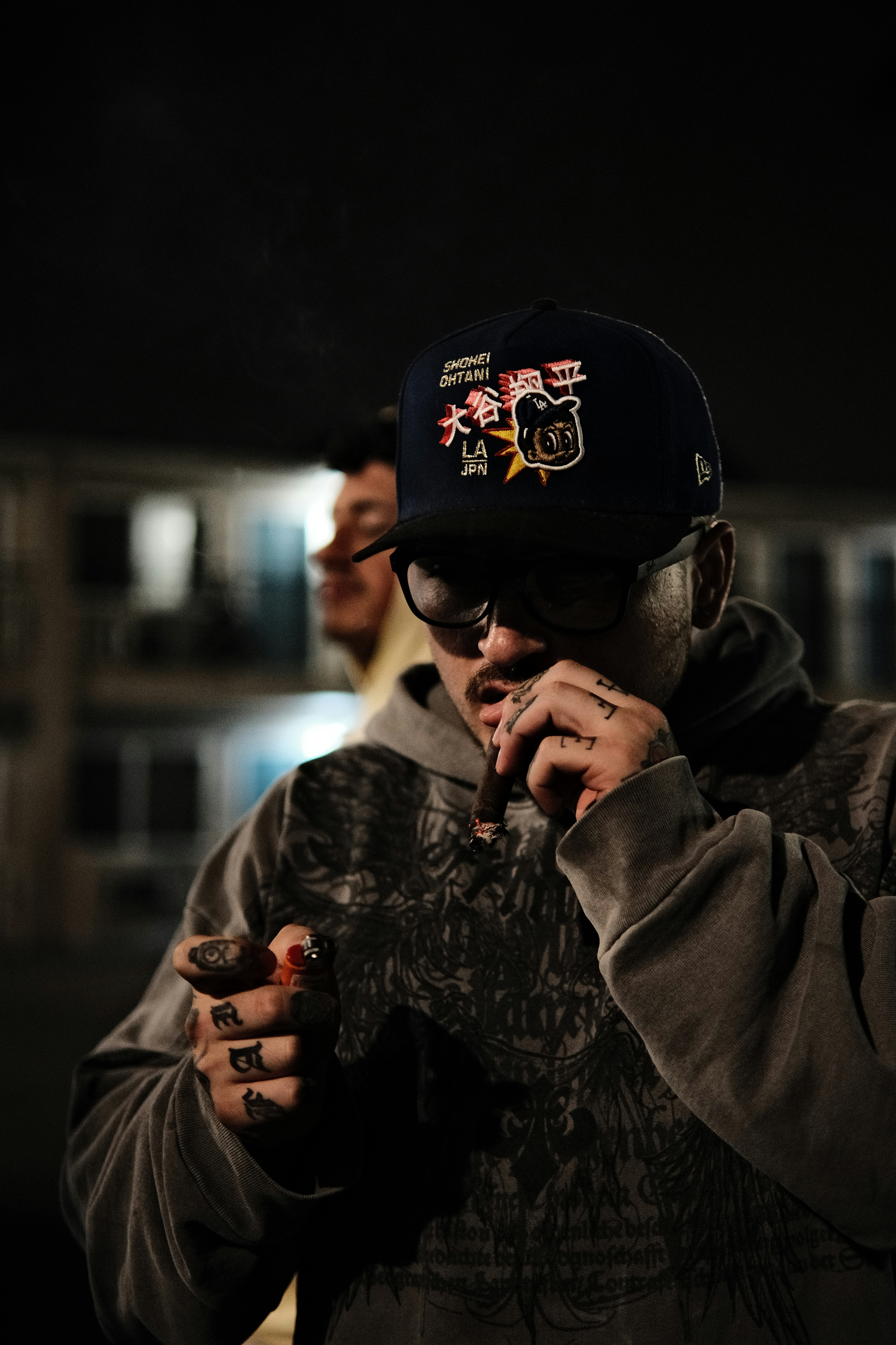 Midnight Ritual: A Hooded Moment Beneath Urban Neon
